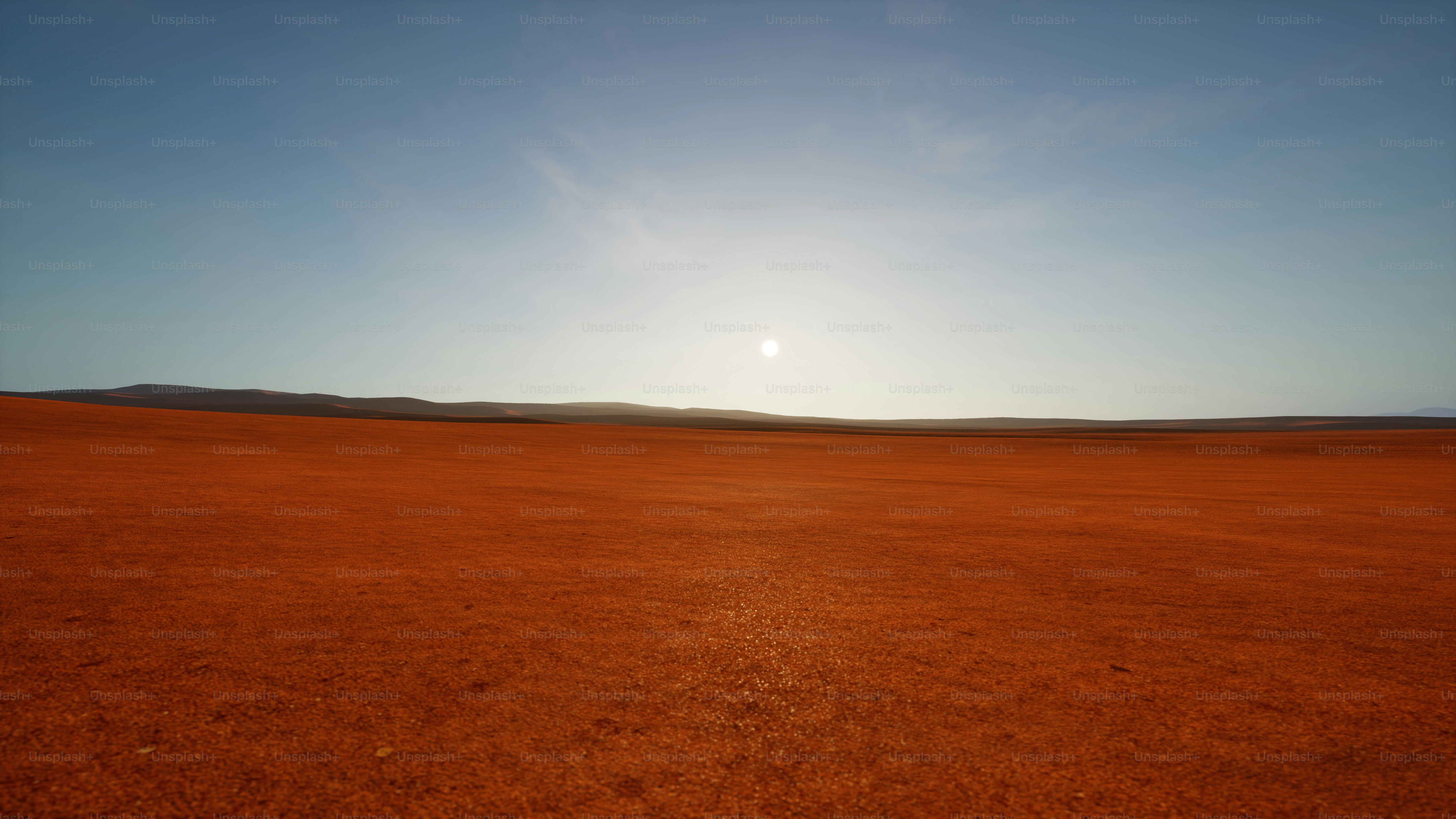 The sun is setting over a barren plain photo – Background Image on Unsplash