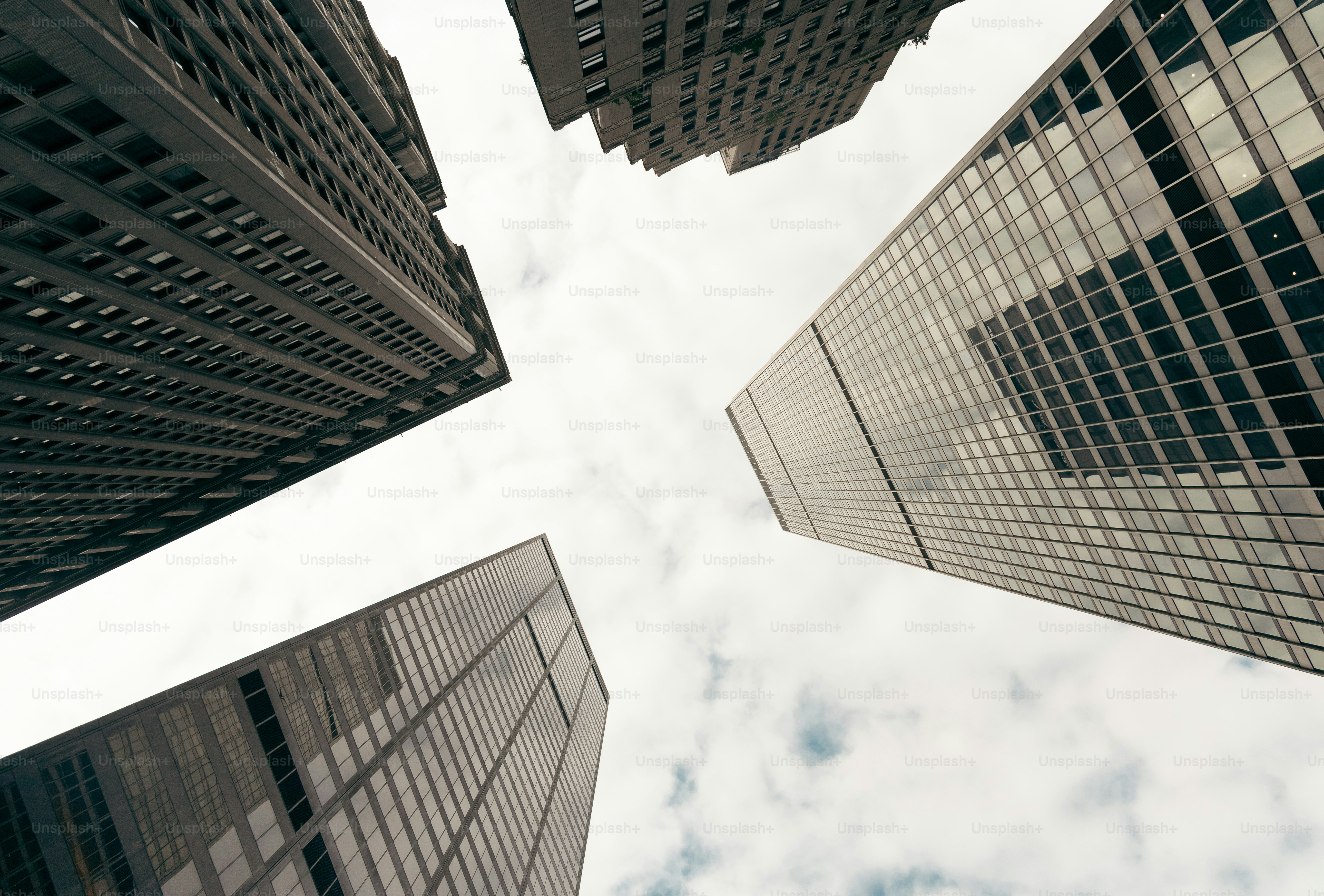 Looking up at tall buildings in a city photo – Architecture background ...