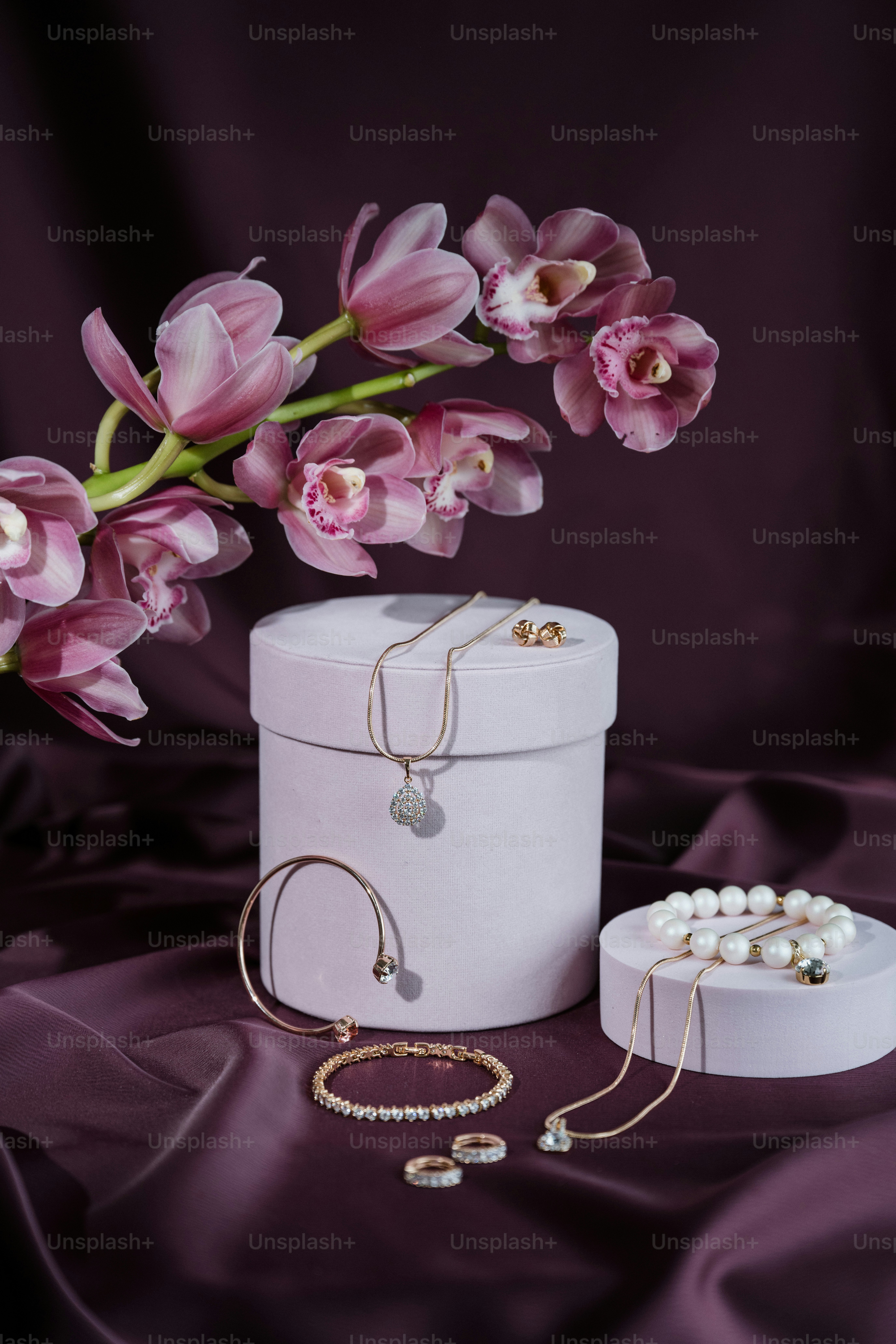 A couple of necklaces sitting on top of a table photo – Pearls Image on ...