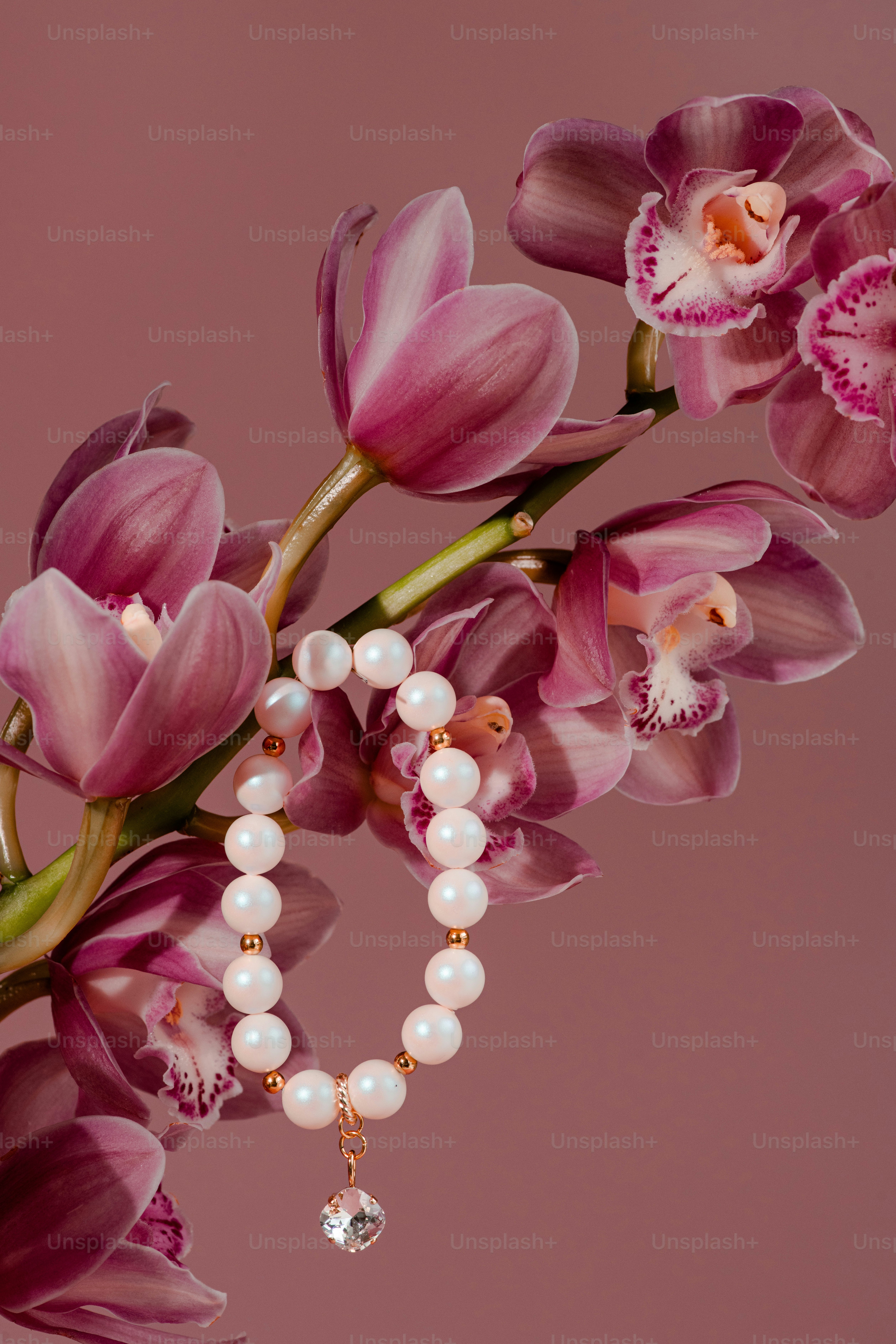 A couple of necklaces sitting on top of a table photo – Pearls Image on ...