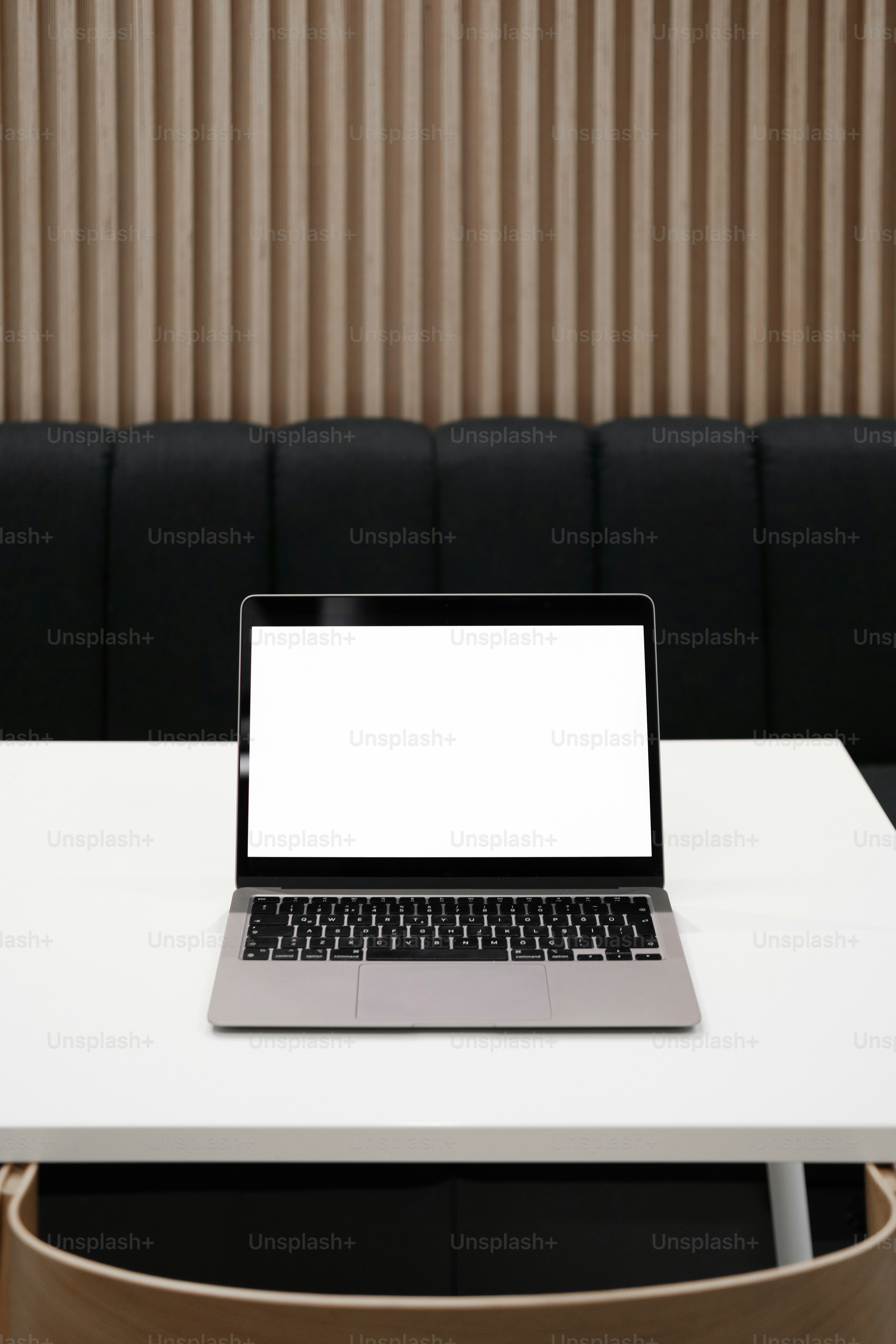 A laptop computer sitting on top of a white table photo – Laptop Image ...
