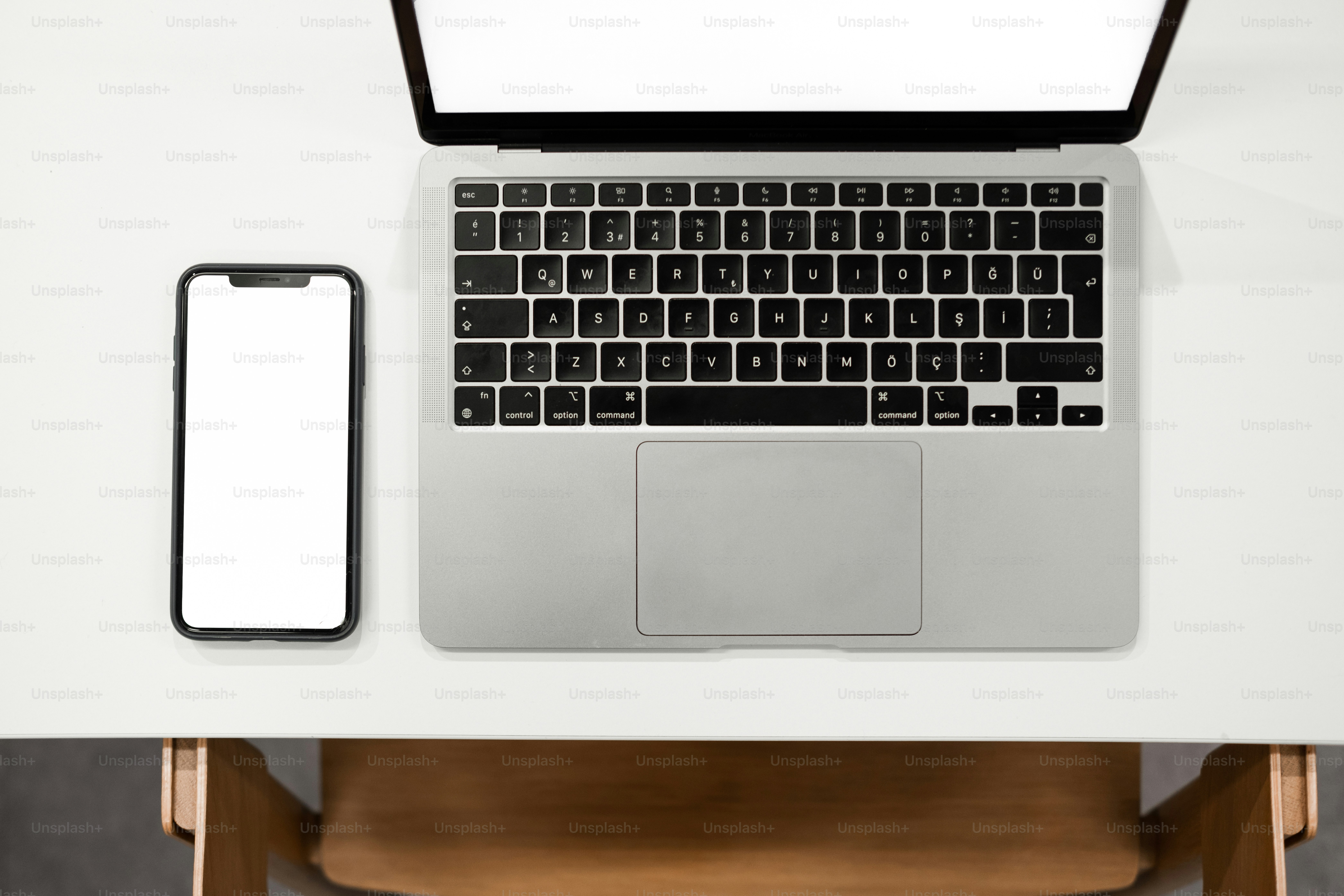 A laptop computer sitting on top of a white desk photo – Laptop Image ...