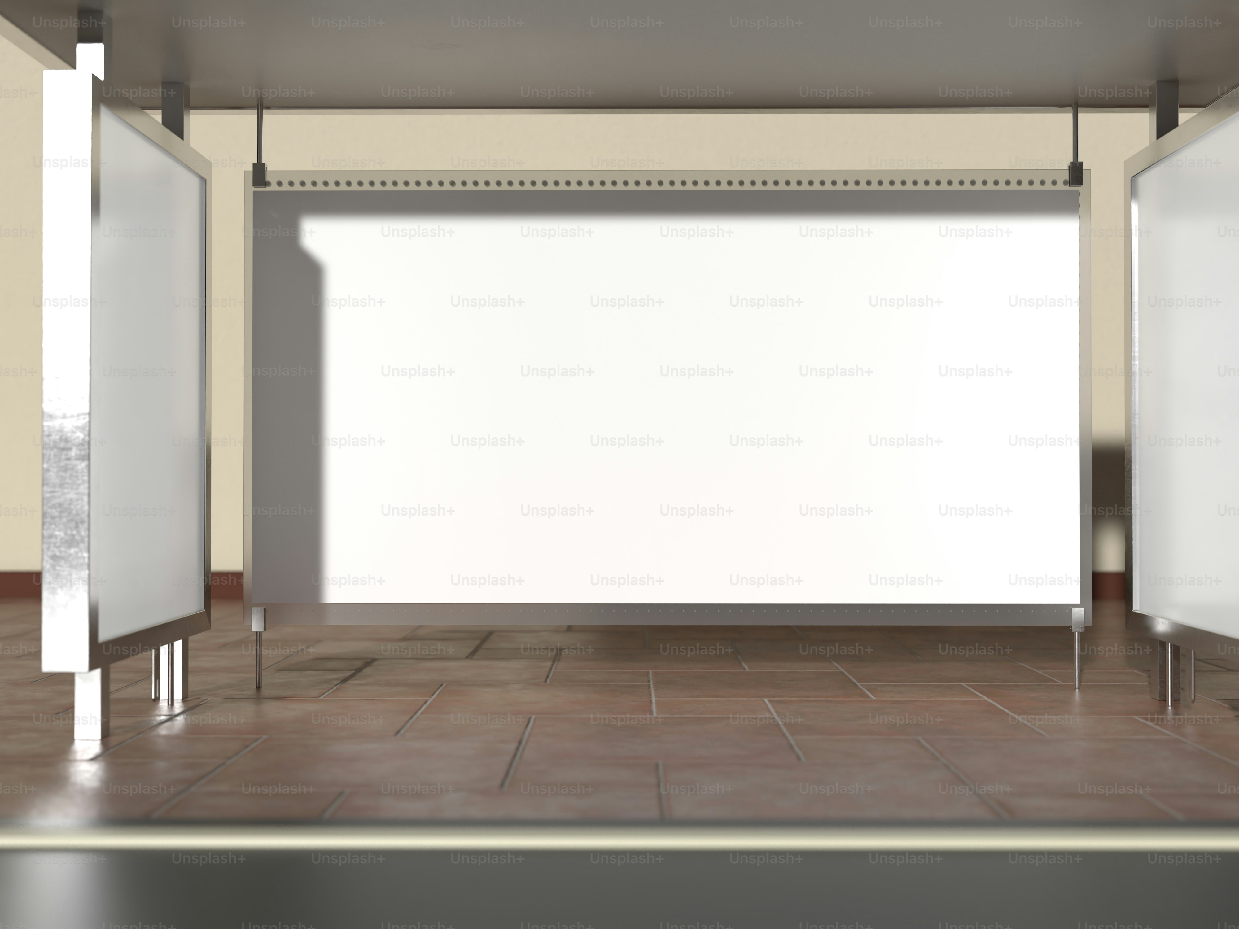 An empty room with a large white screen photo – Mockup Image on Unsplash
