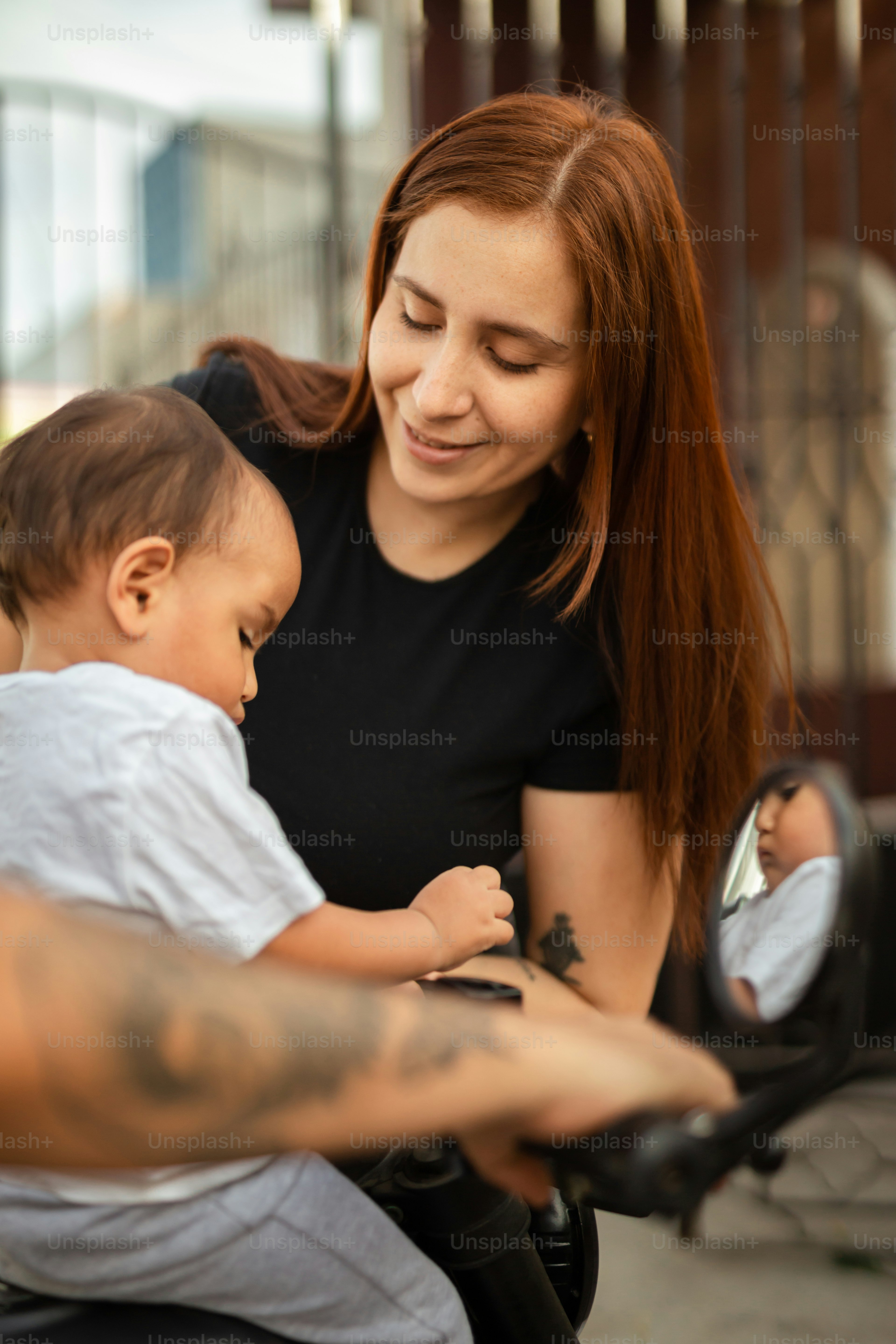 A woman holding a baby in her arms photo – Latino family Image on Unsplash