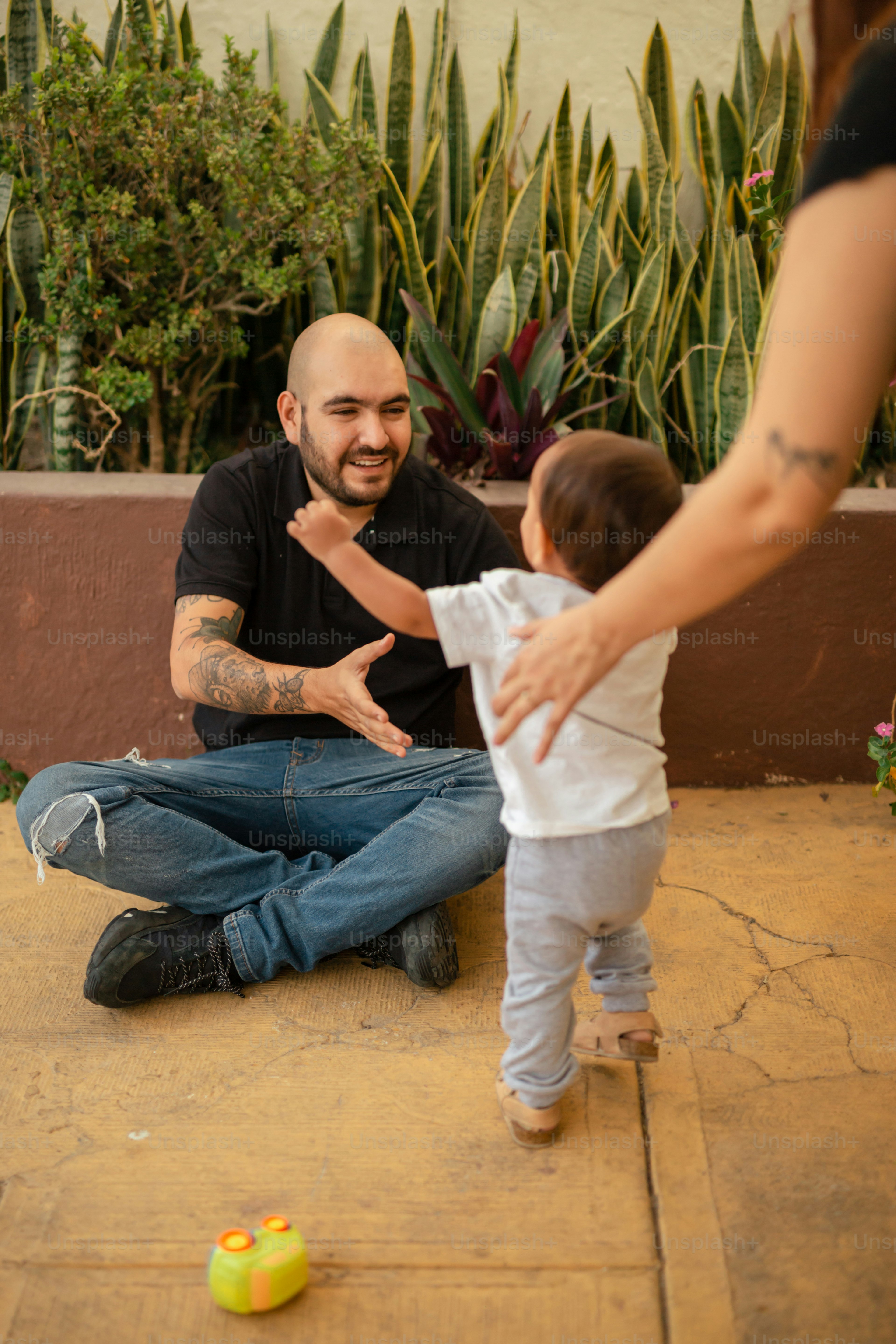 A man and a little boy standing next to a motorcycle photo – Dad Image ...