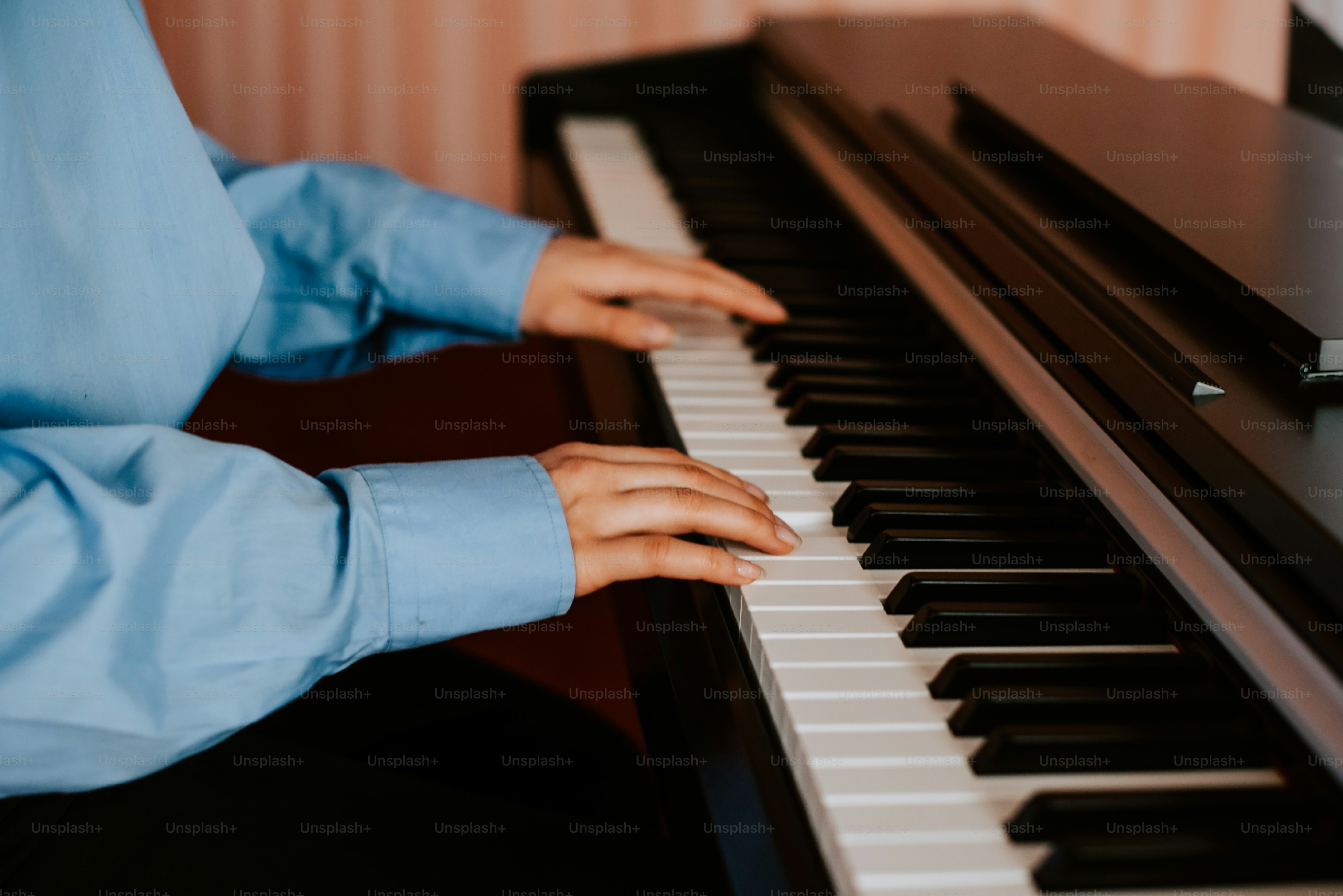 A close up of a person playing a piano photo – Keyboard Image on Unsplash