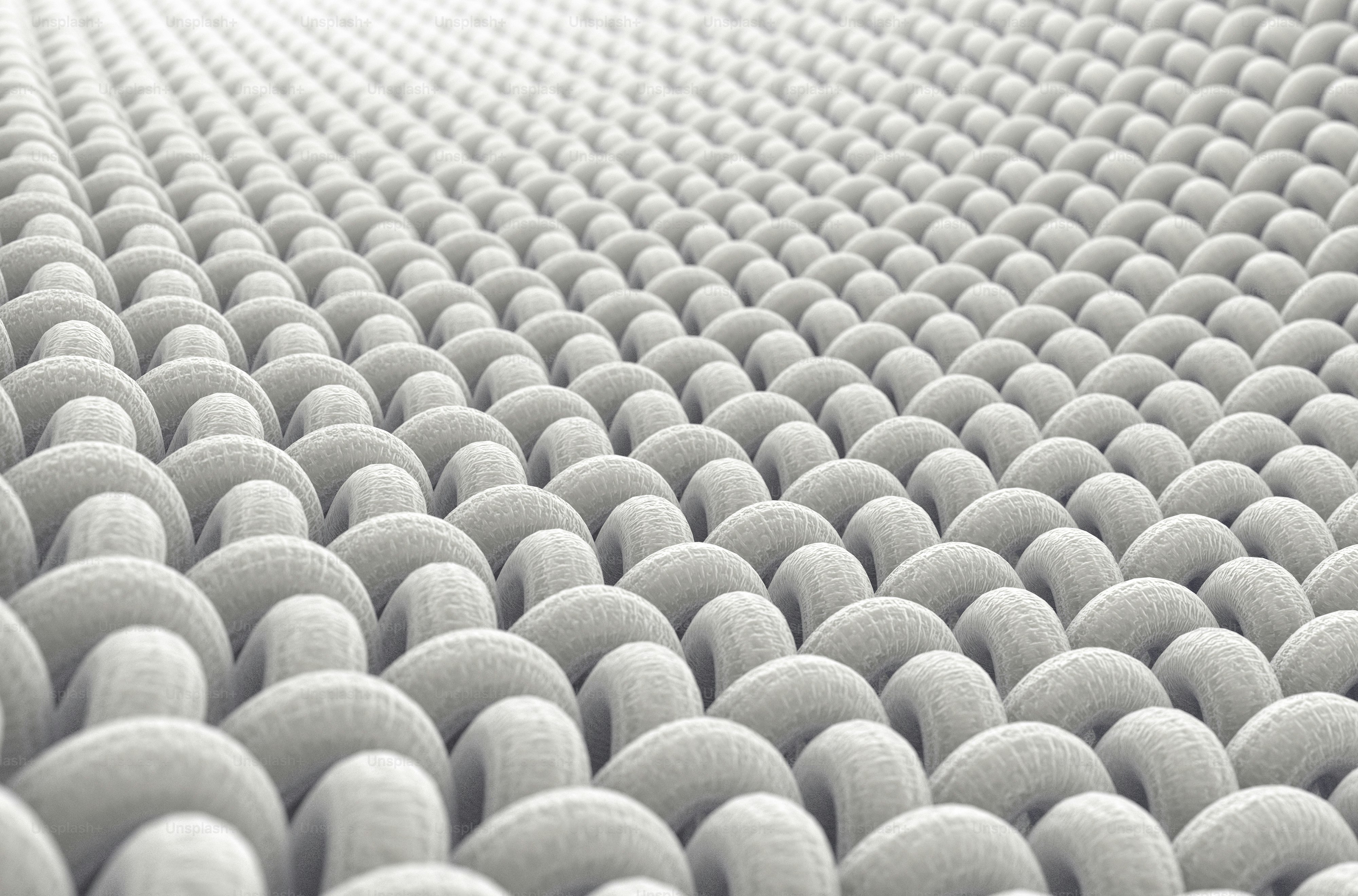 A microscopic close up view of a simple woven textile on a white ...