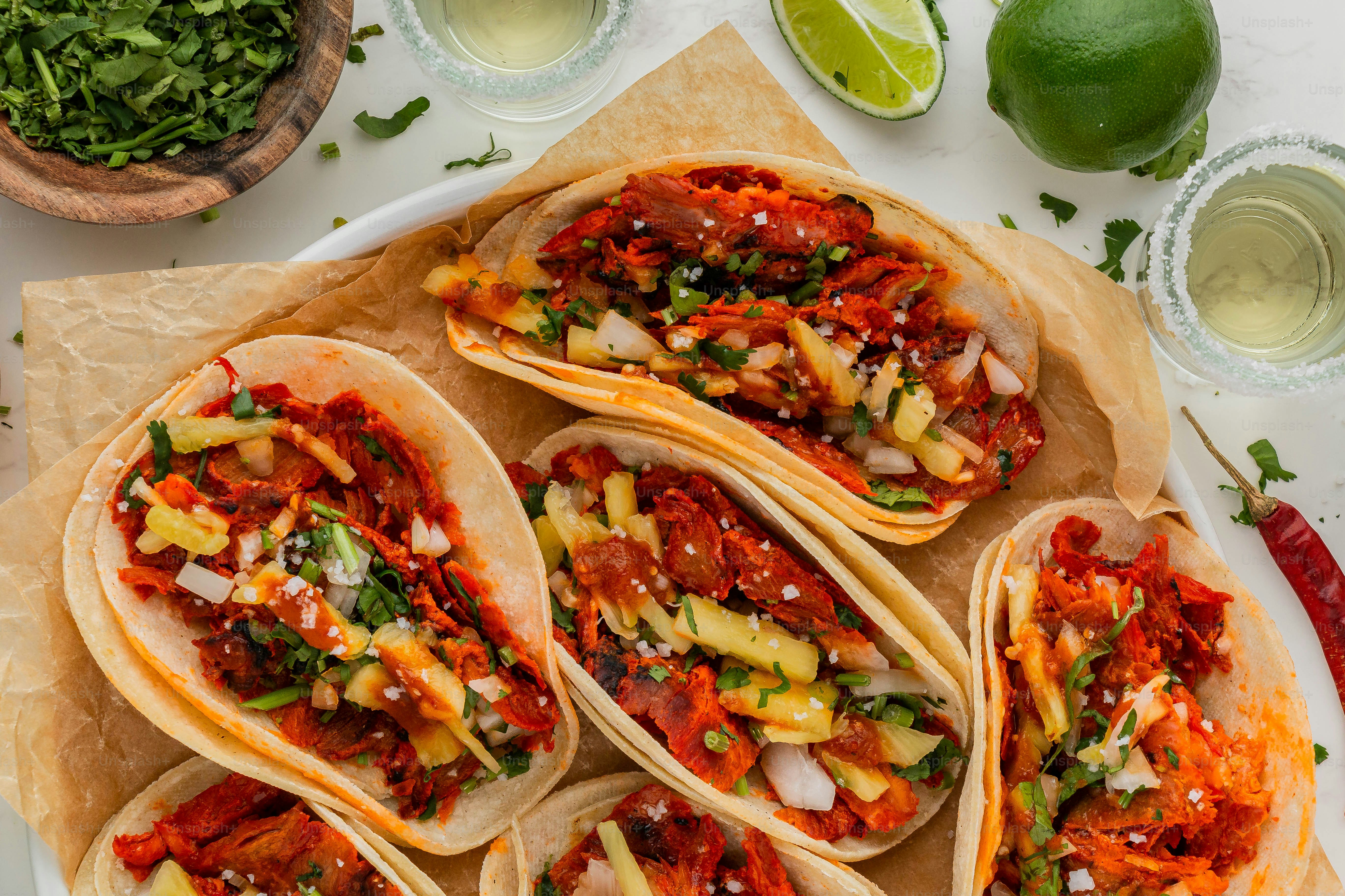 A group of tacos sitting on top of each other photo – Mexican food ...
