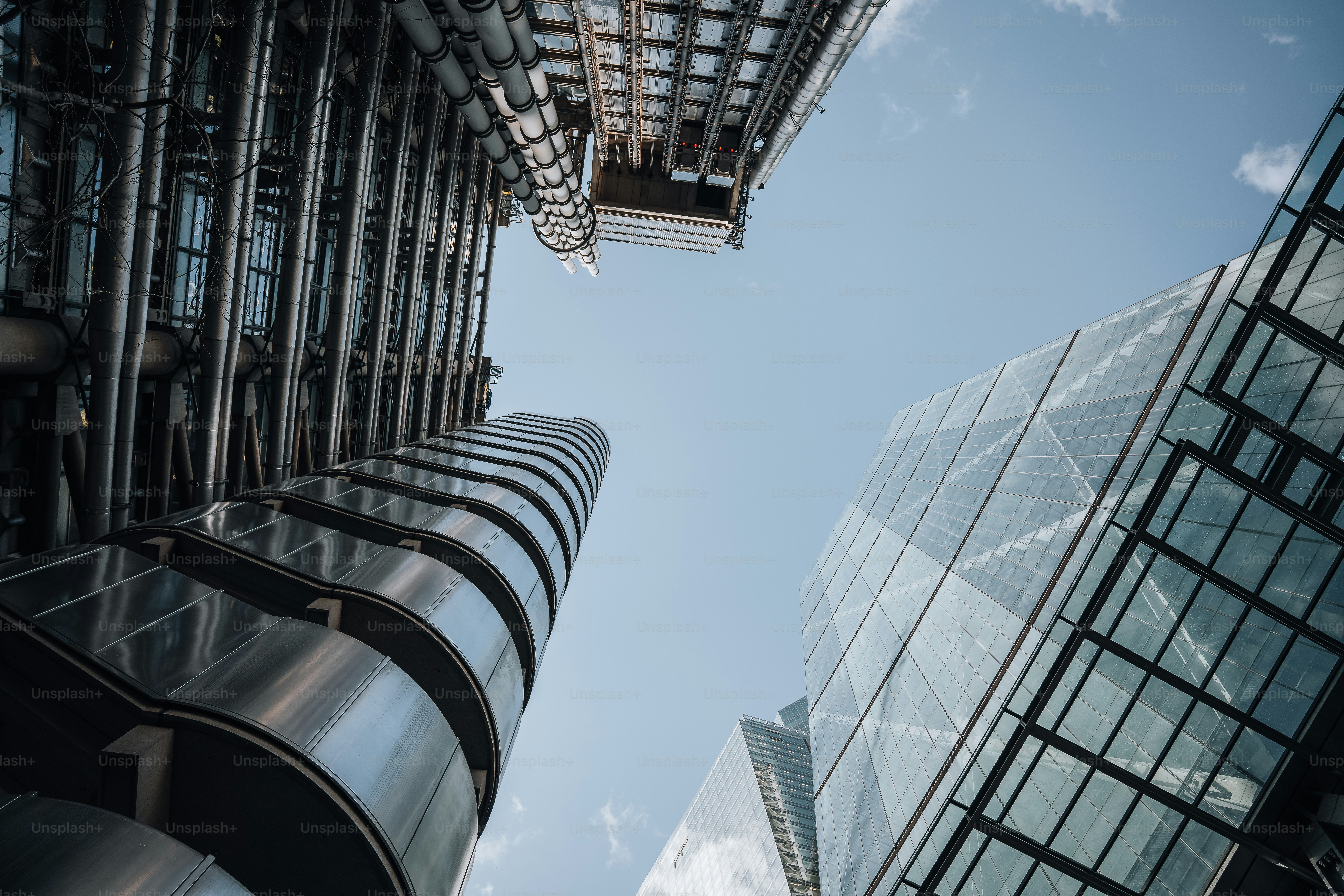 Looking up at two tall buildings in a city photo – Skyscrapers Image on ...