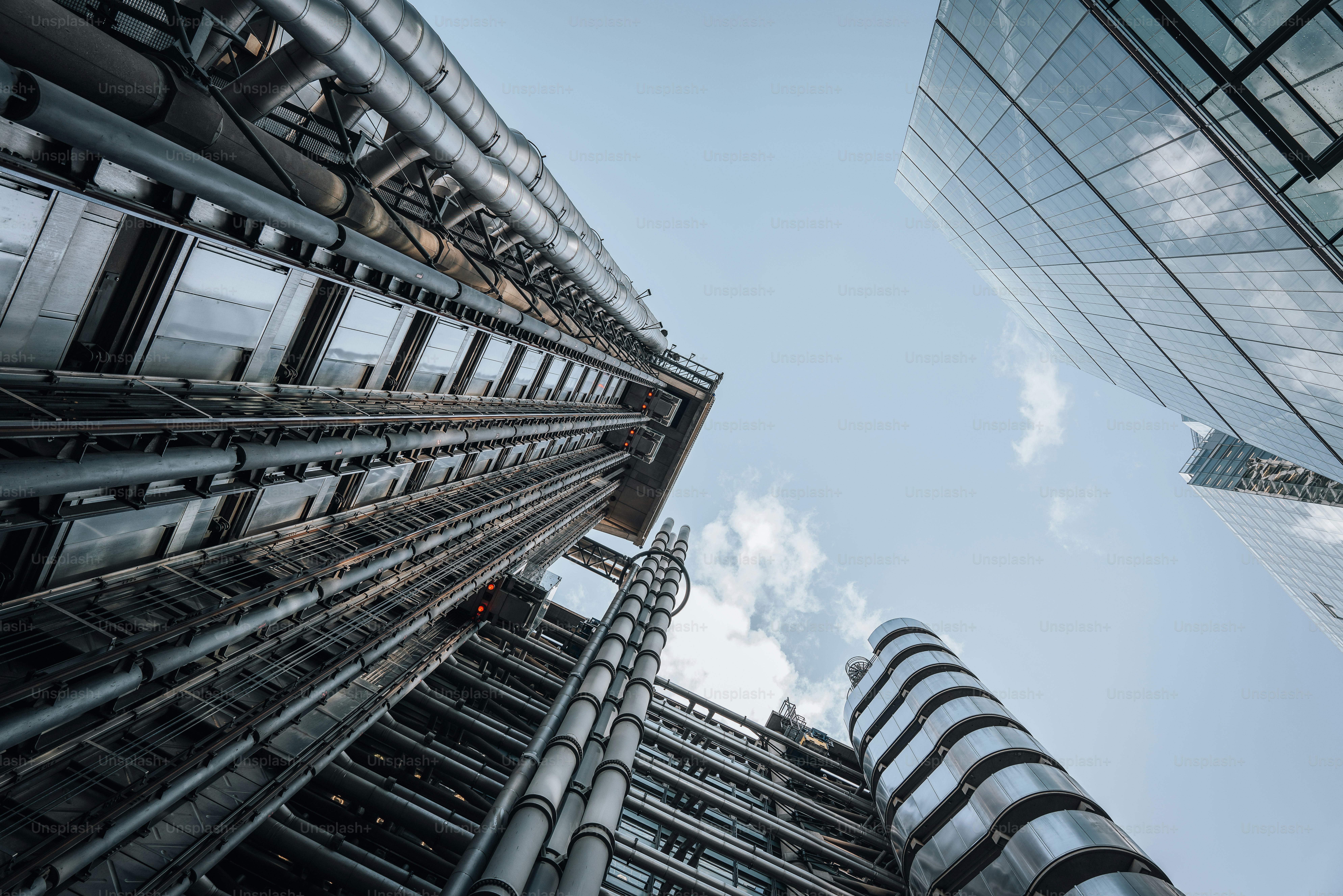 Looking up at tall buildings in a city photo – City Image on Unsplash
