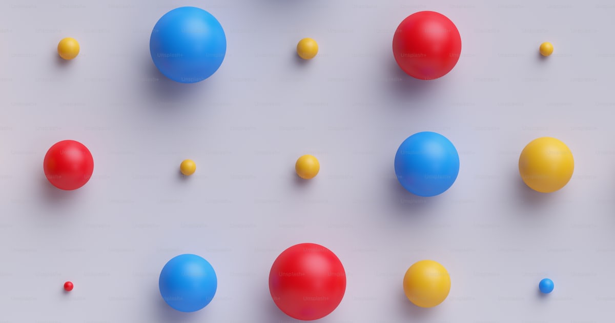 白い背景に3dレンダリング、抽象的なカラフルなボール、ビーズ、キャンディー、丸薬、赤青、黄色の混合色、分離型の写真 三次元 Unsplashの写真