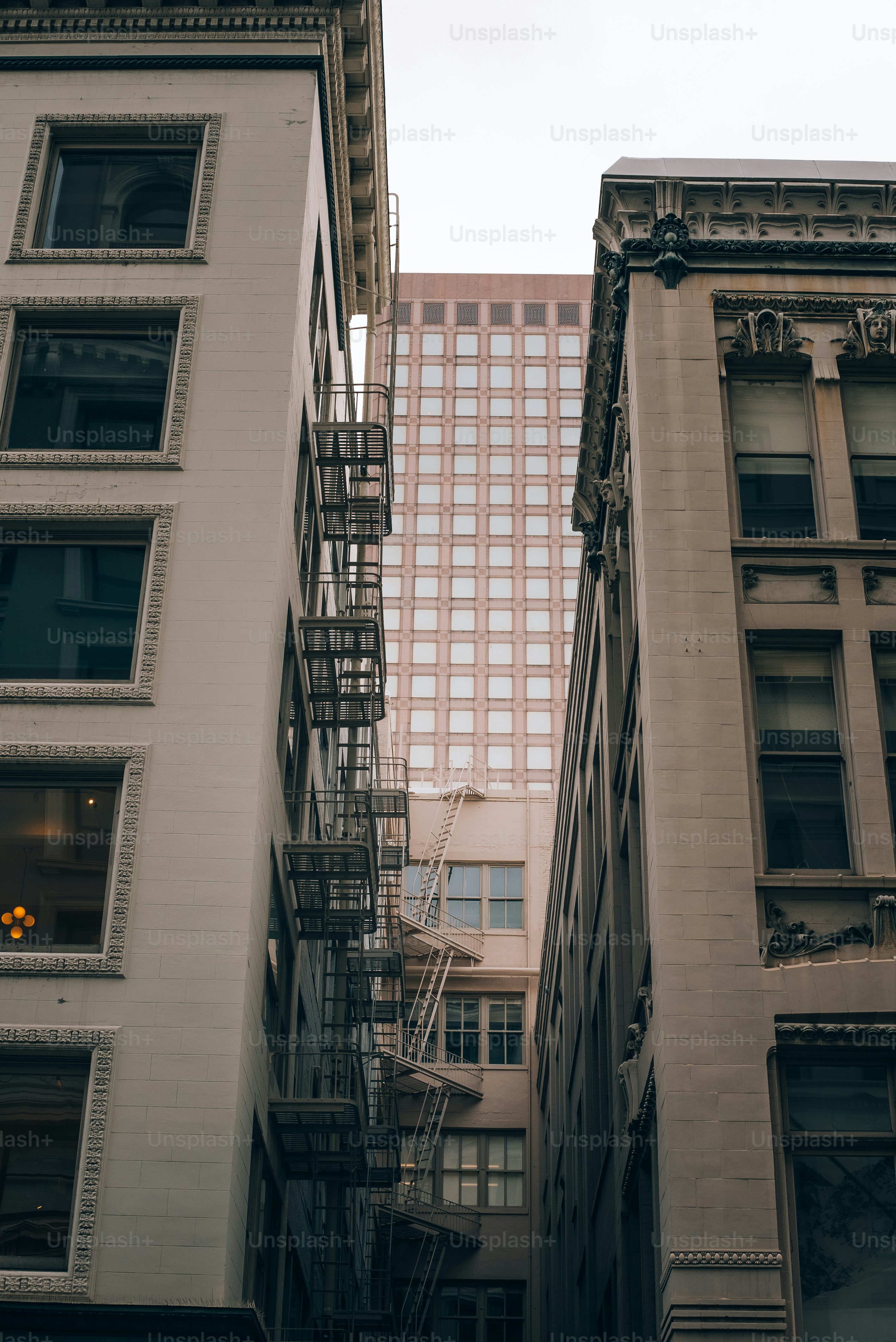 A couple of tall buildings next to each other photo – Urban Image on ...