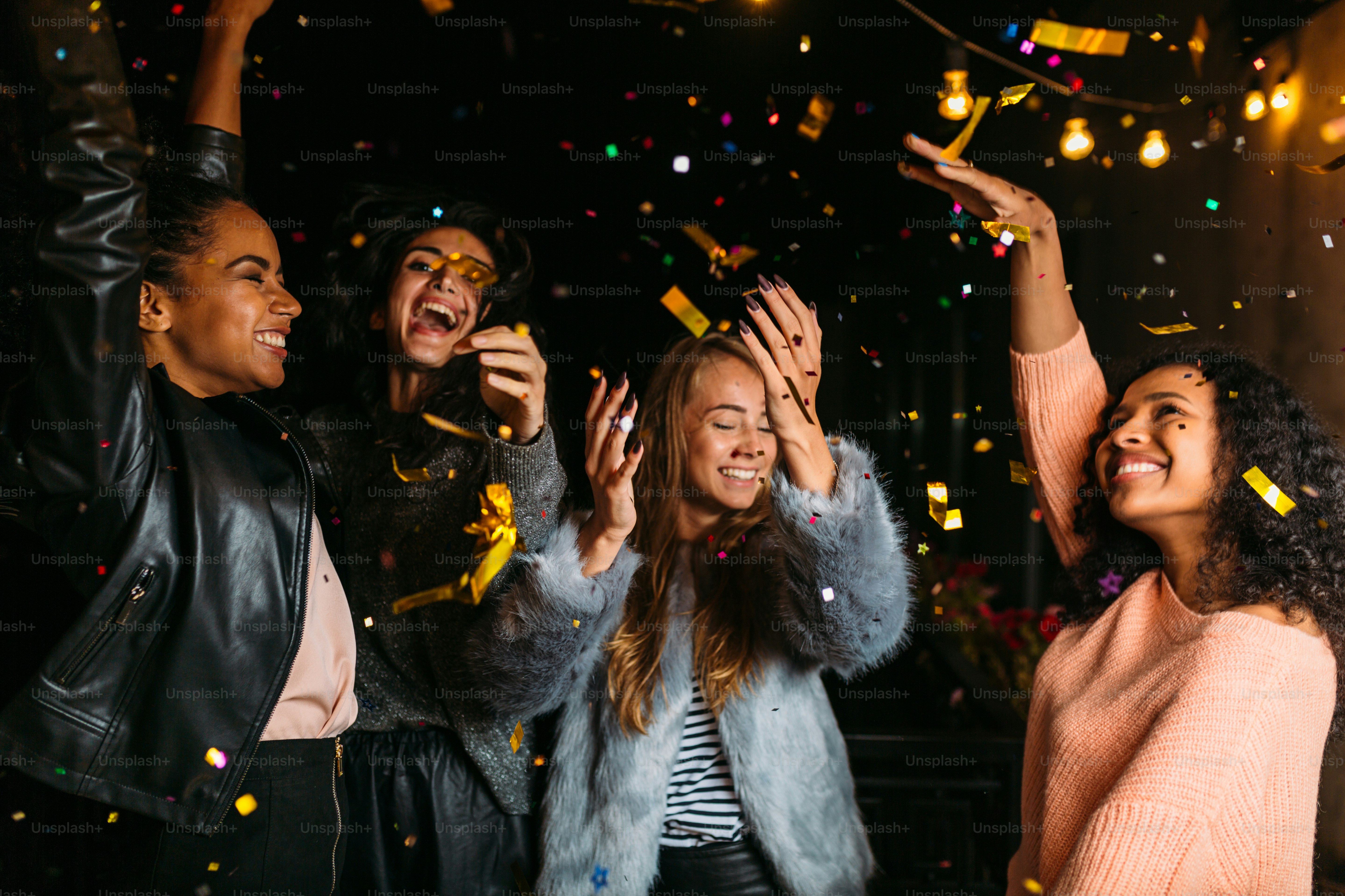 Happy women enjoying party at night, dancing on a terrace photo – Afro ...