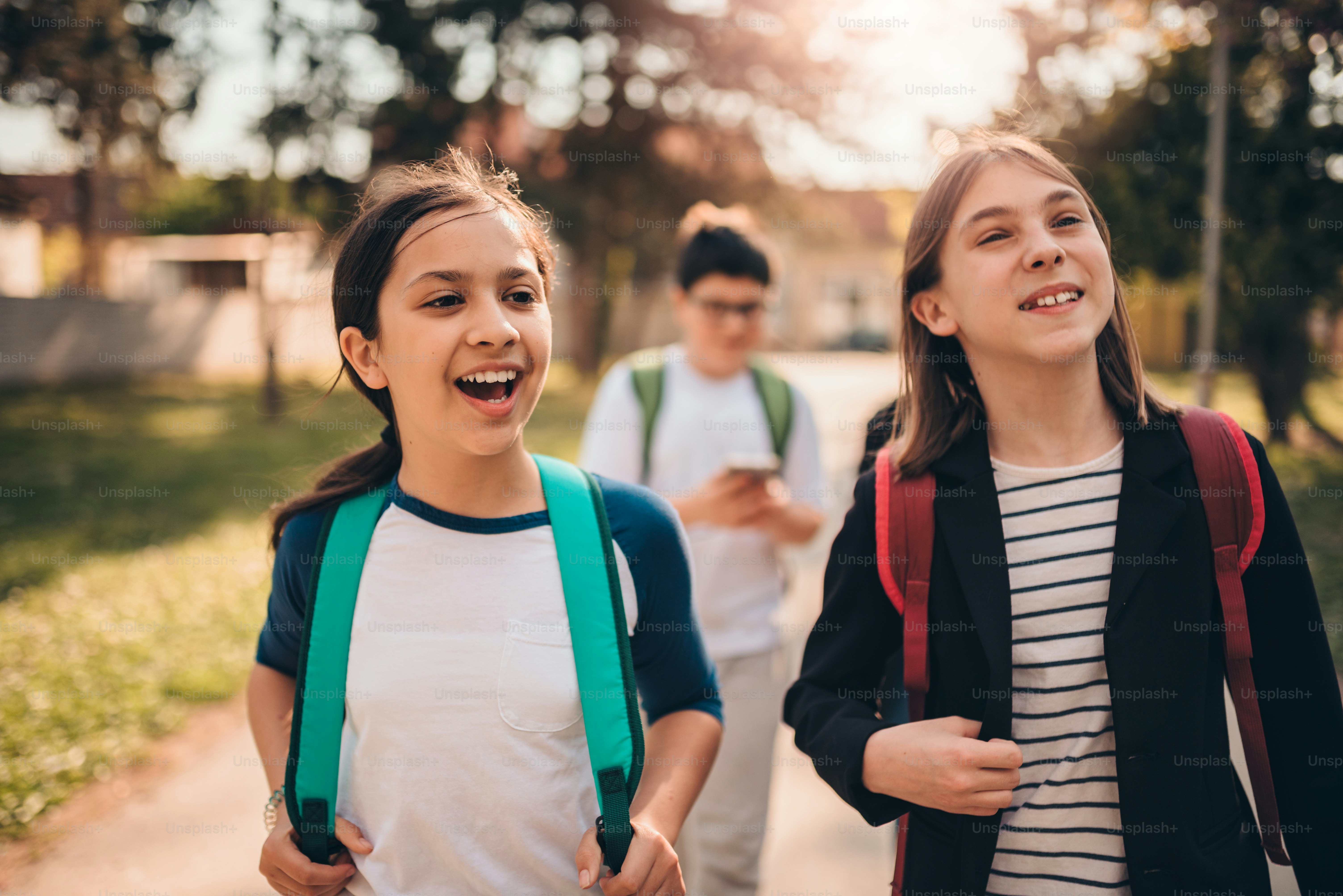 Girls wearing backpack going to school photo – People Image on Unsplash
