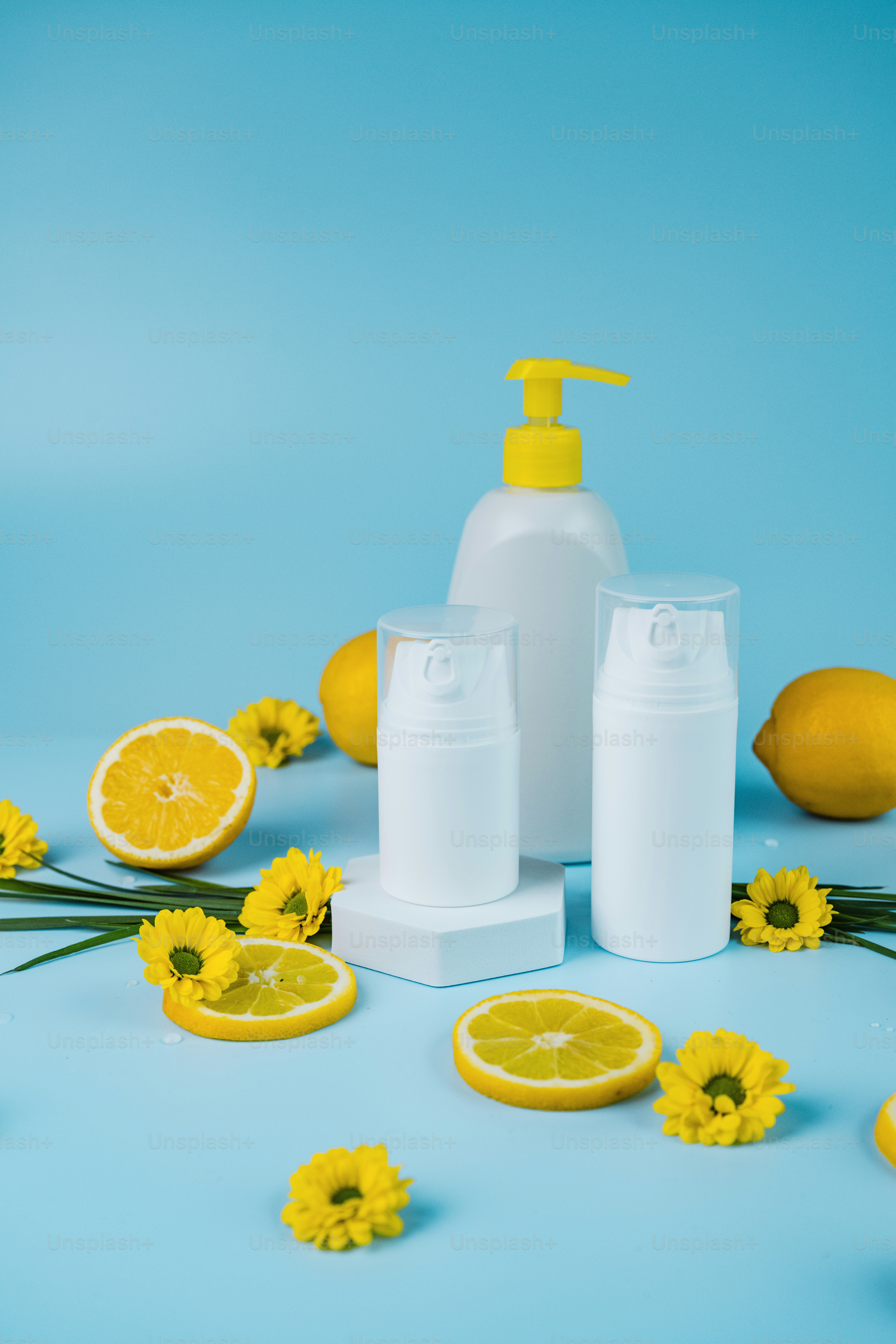 A bottle of lotion next to a bunch of lemons photo – Mockup Image on ...