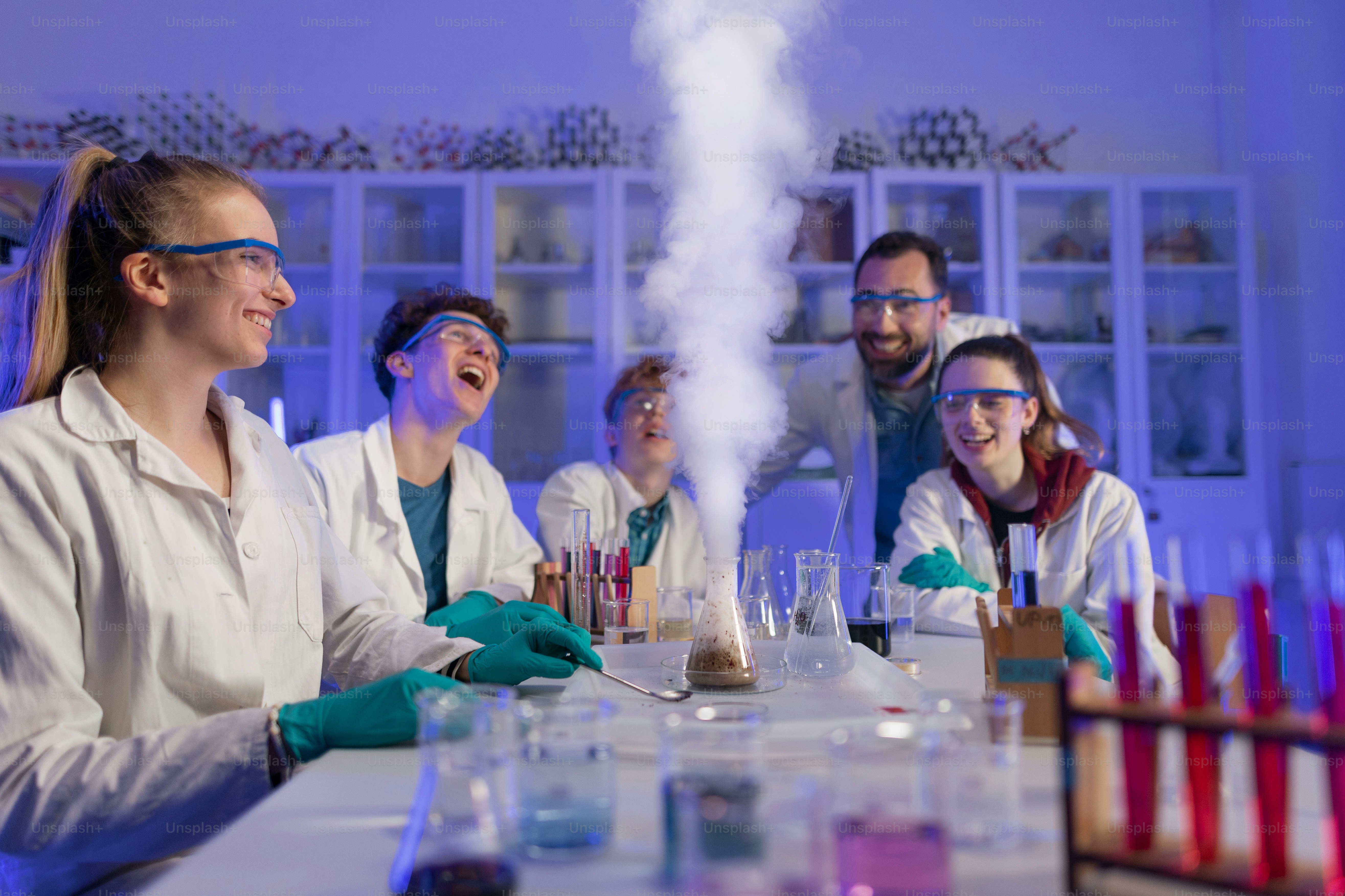 Science students doing a chemical experiment in the laboratory at ...