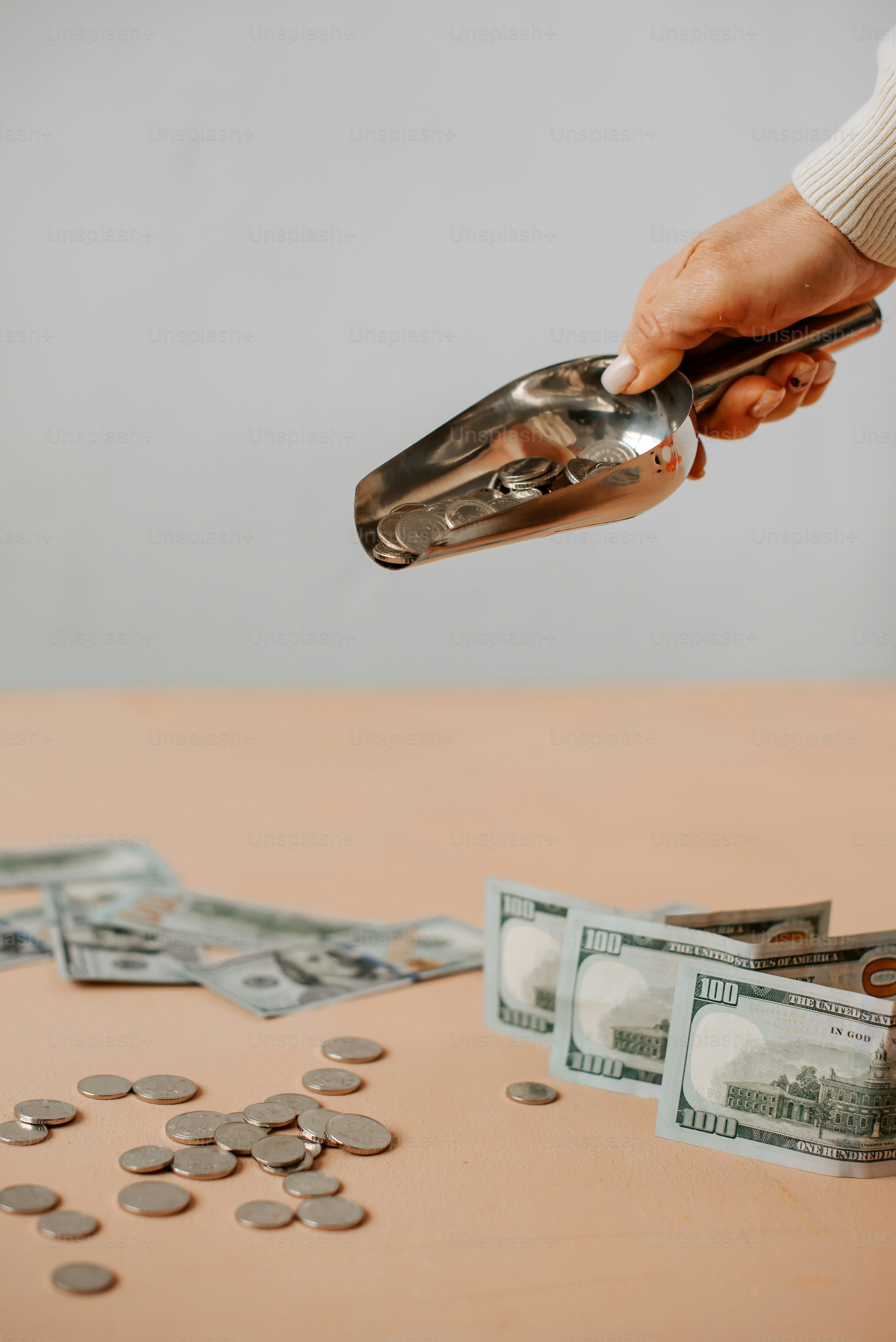 A person holding a bunch of money in their hands photo – Finance and ...