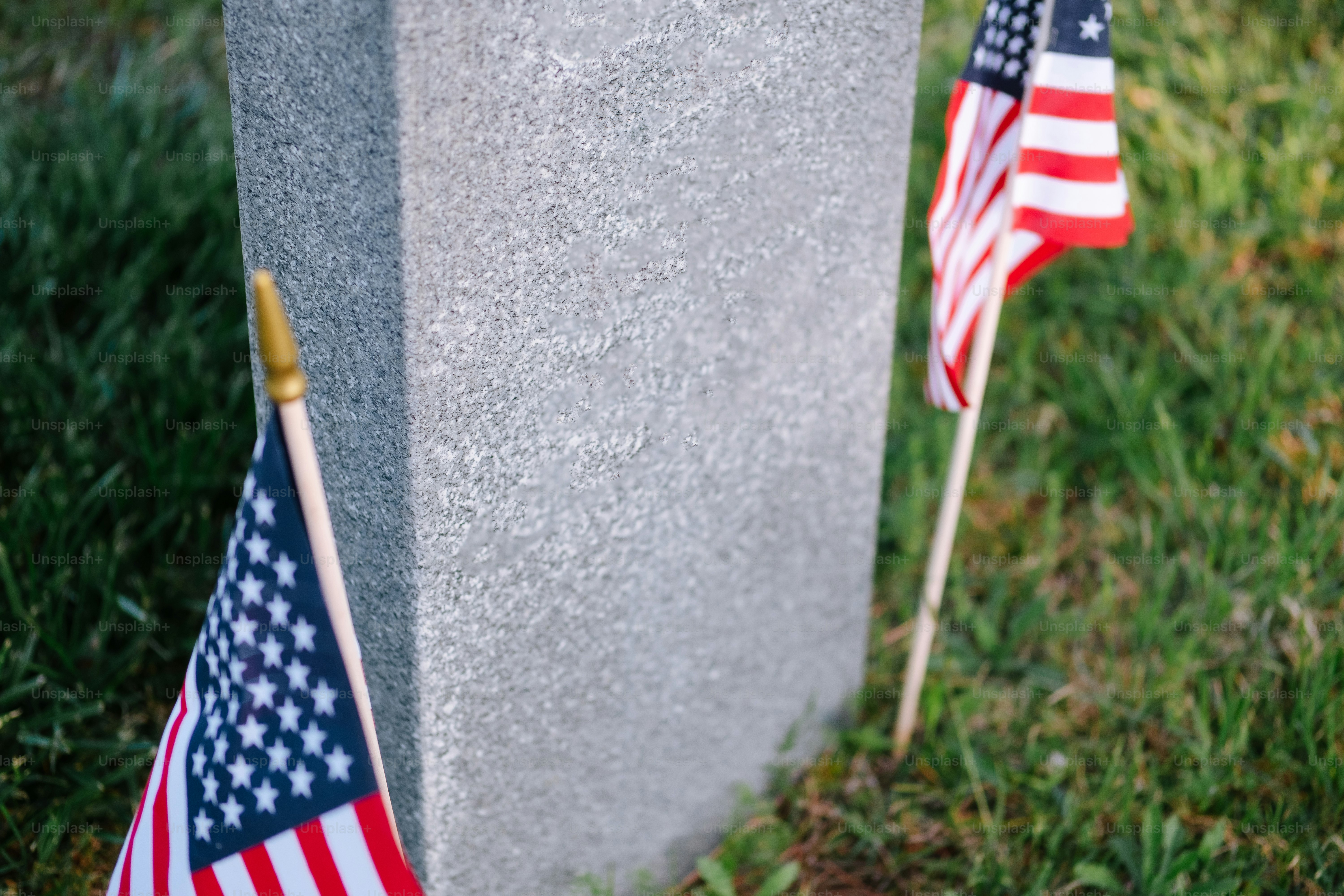 Two american flags are placed next to a grave photo – American flag ...