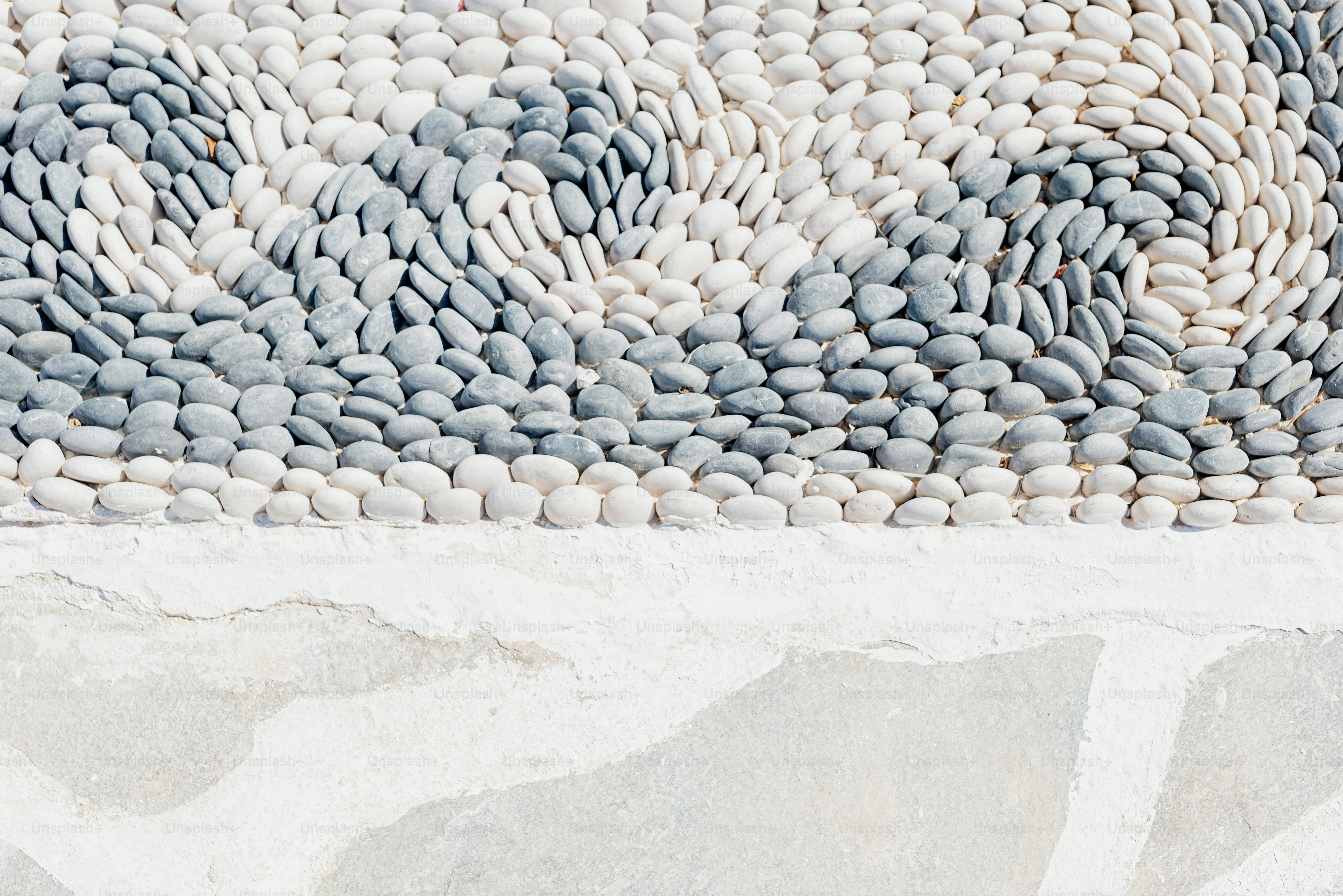 A close up of a rug made of pebbles photo – Greece Image on Unsplash