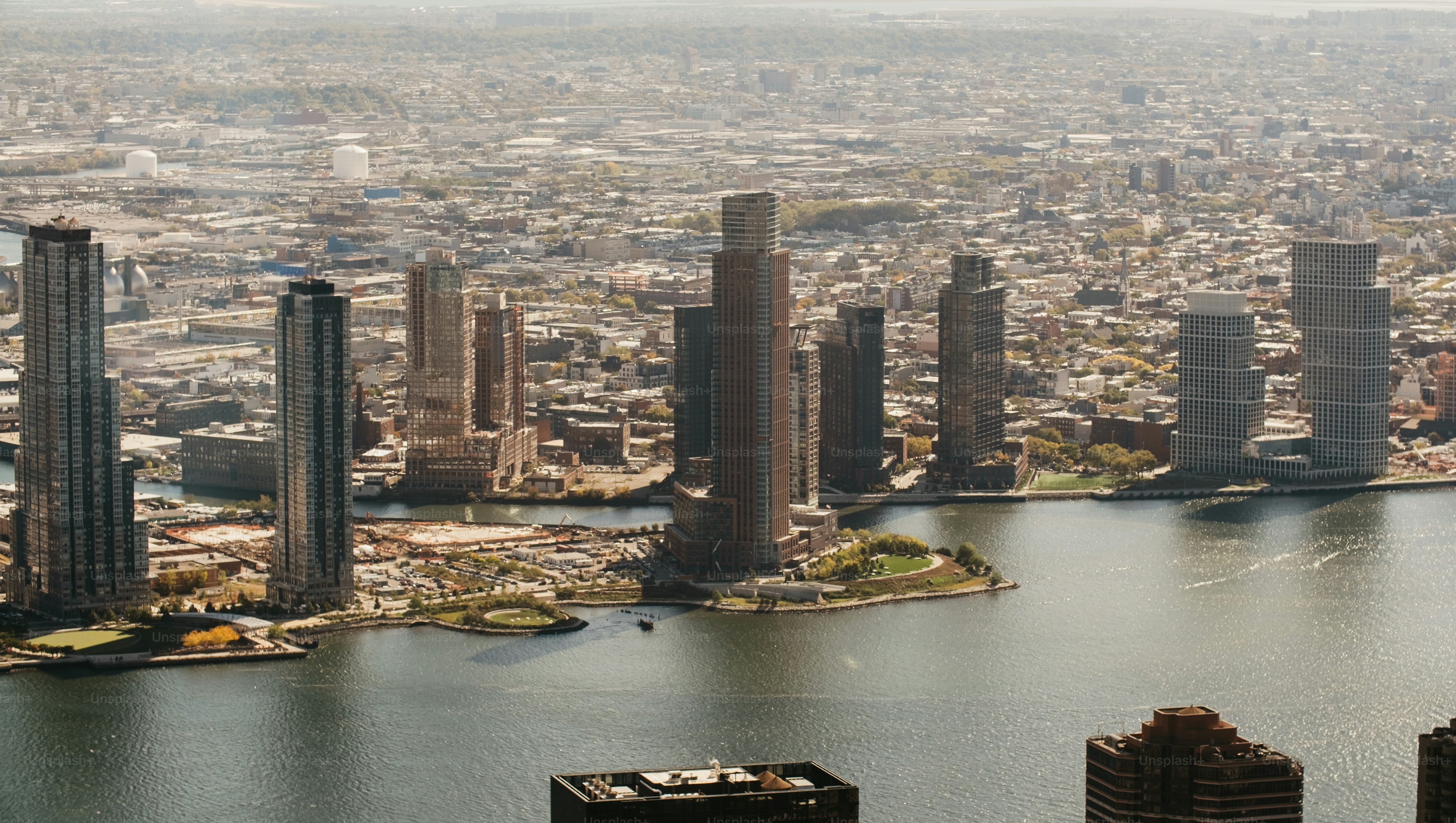 An aerial view of a city with tall buildings photo – New york Image on ...