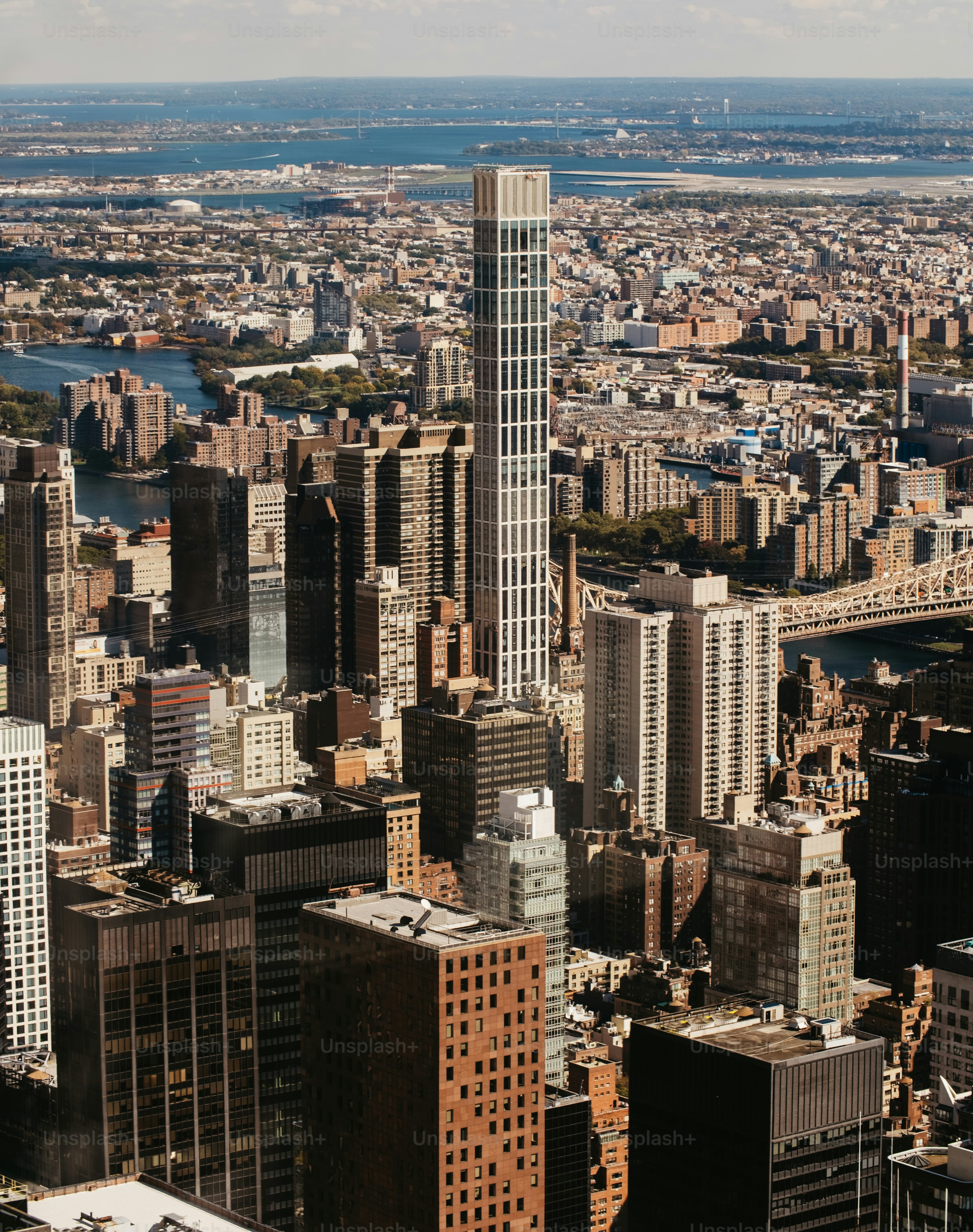 A view of a large city with tall buildings photo – New york Image on ...