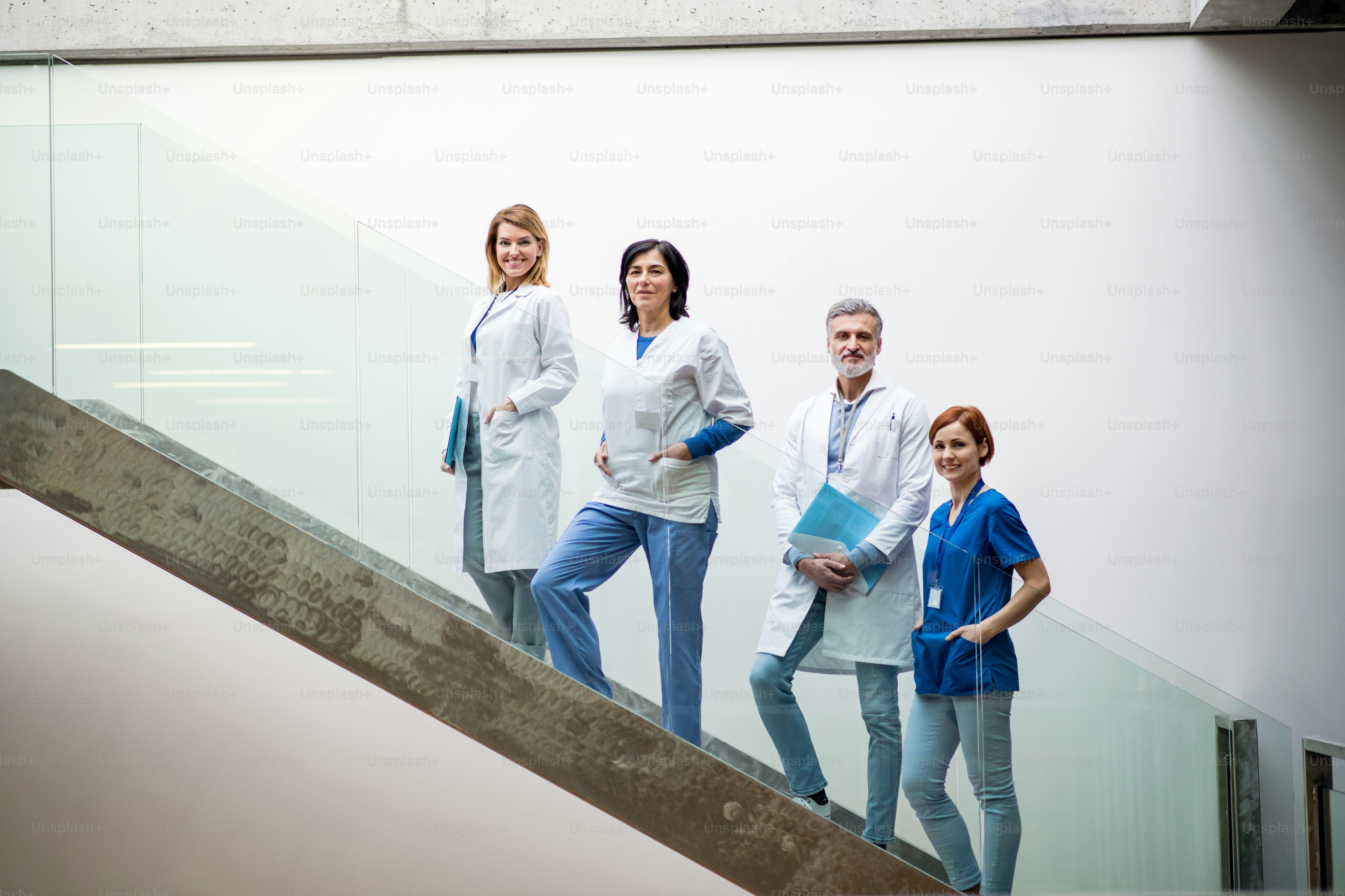 Group of doctors standing on conference, front view portrait of medical ...