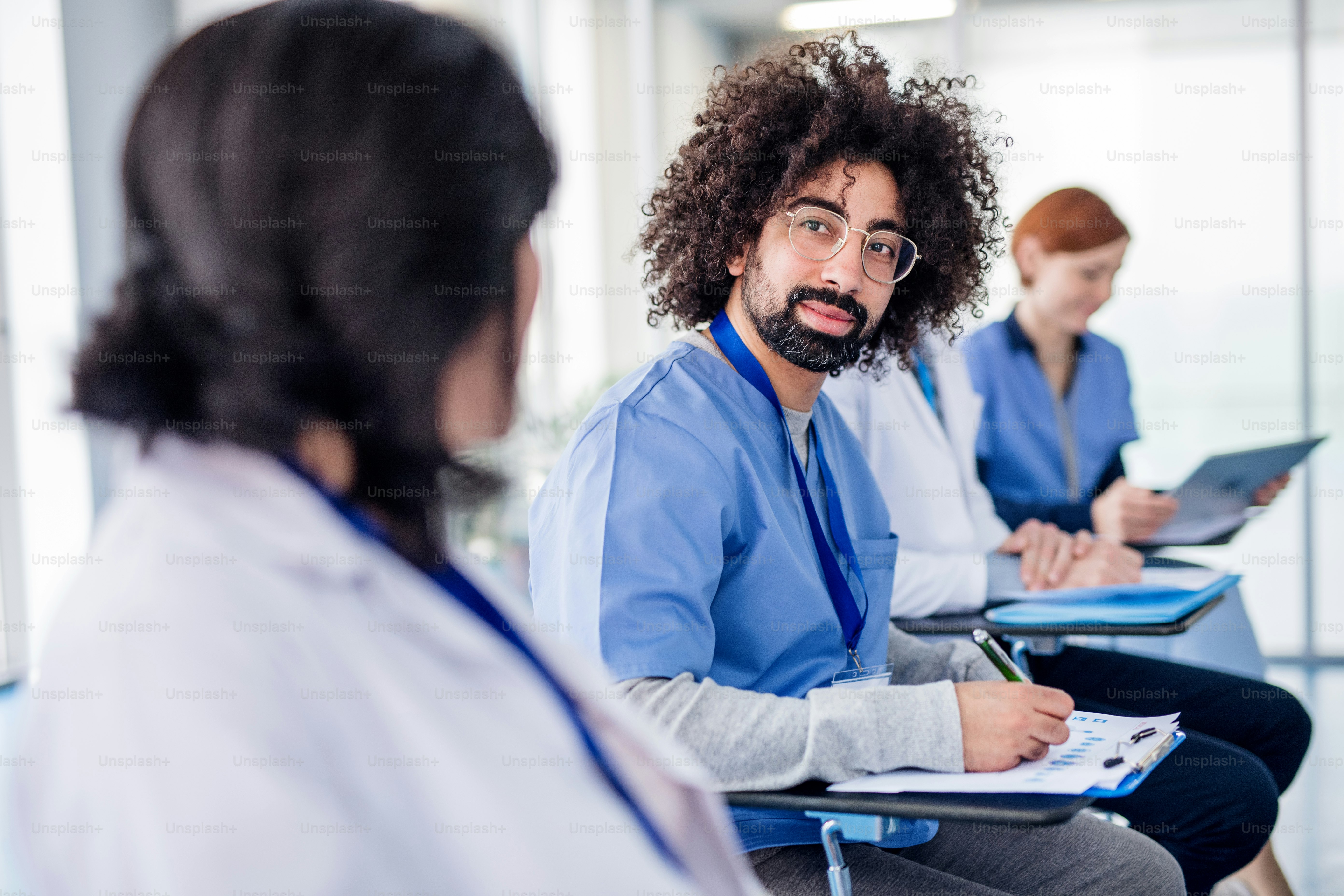 Group of doctors standing on conference, front view portrait of medical ...