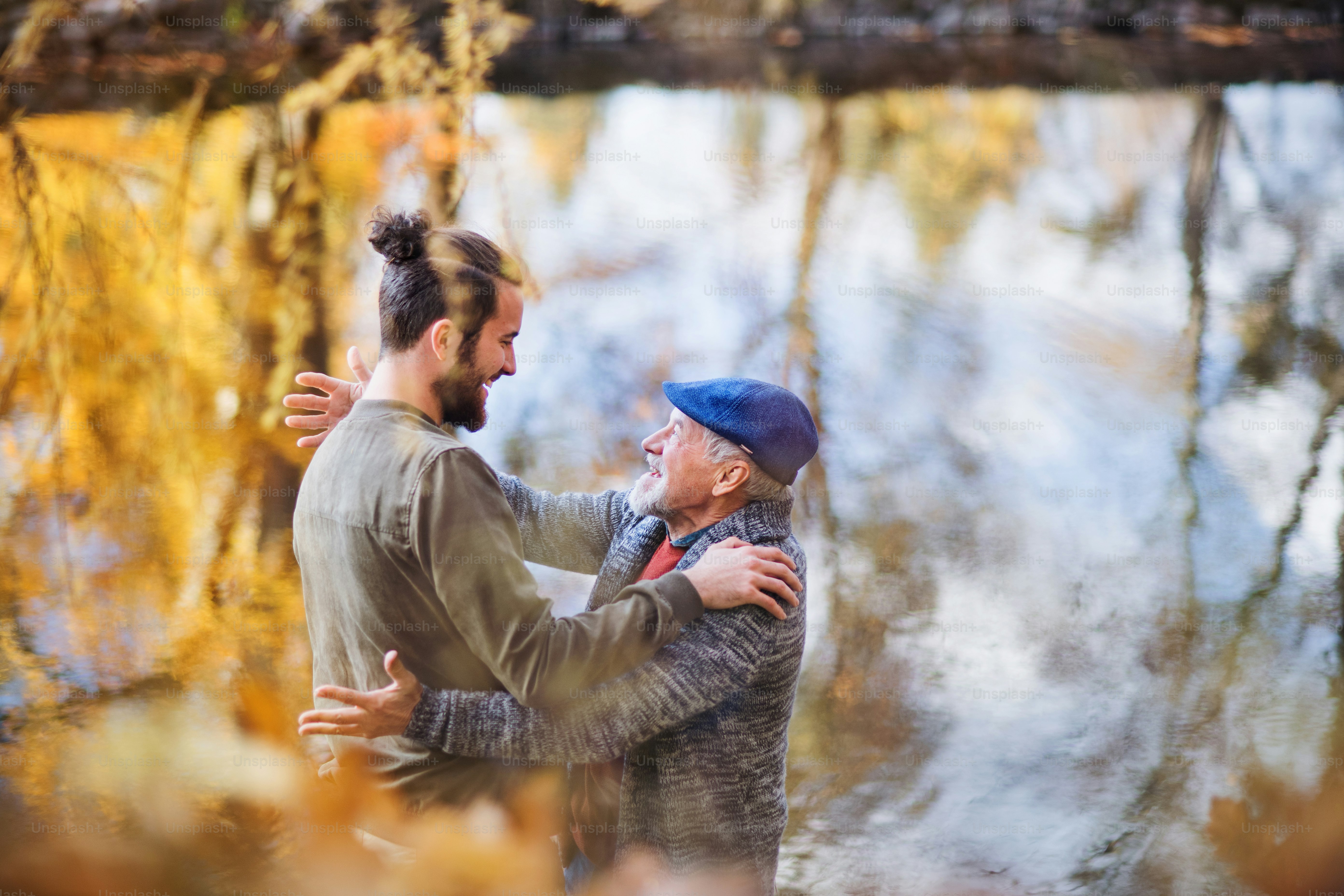 A high angle view of senior father and his son standing in nature ...