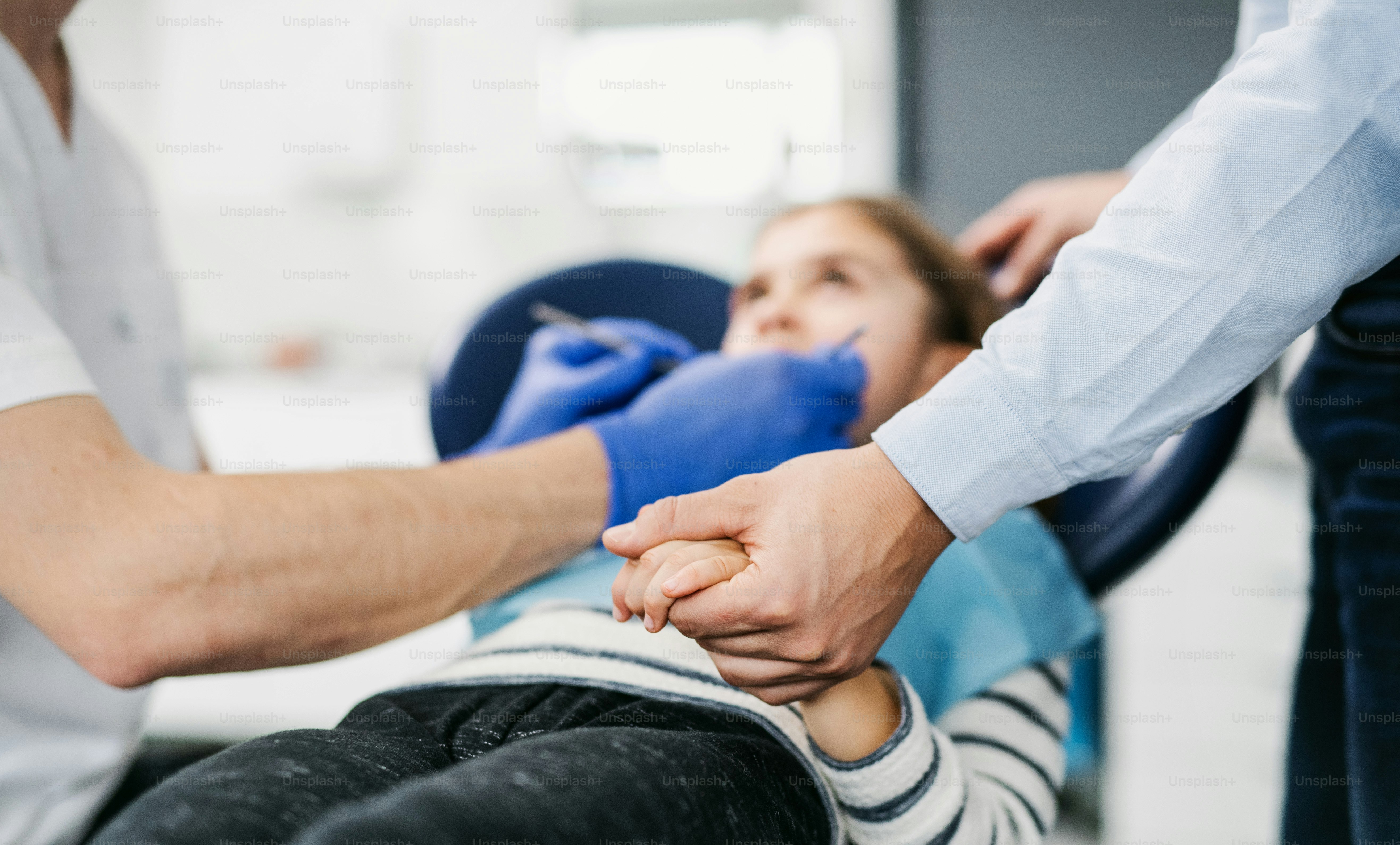 A woman has an annual dental check-up in dentist surgery. photo ...