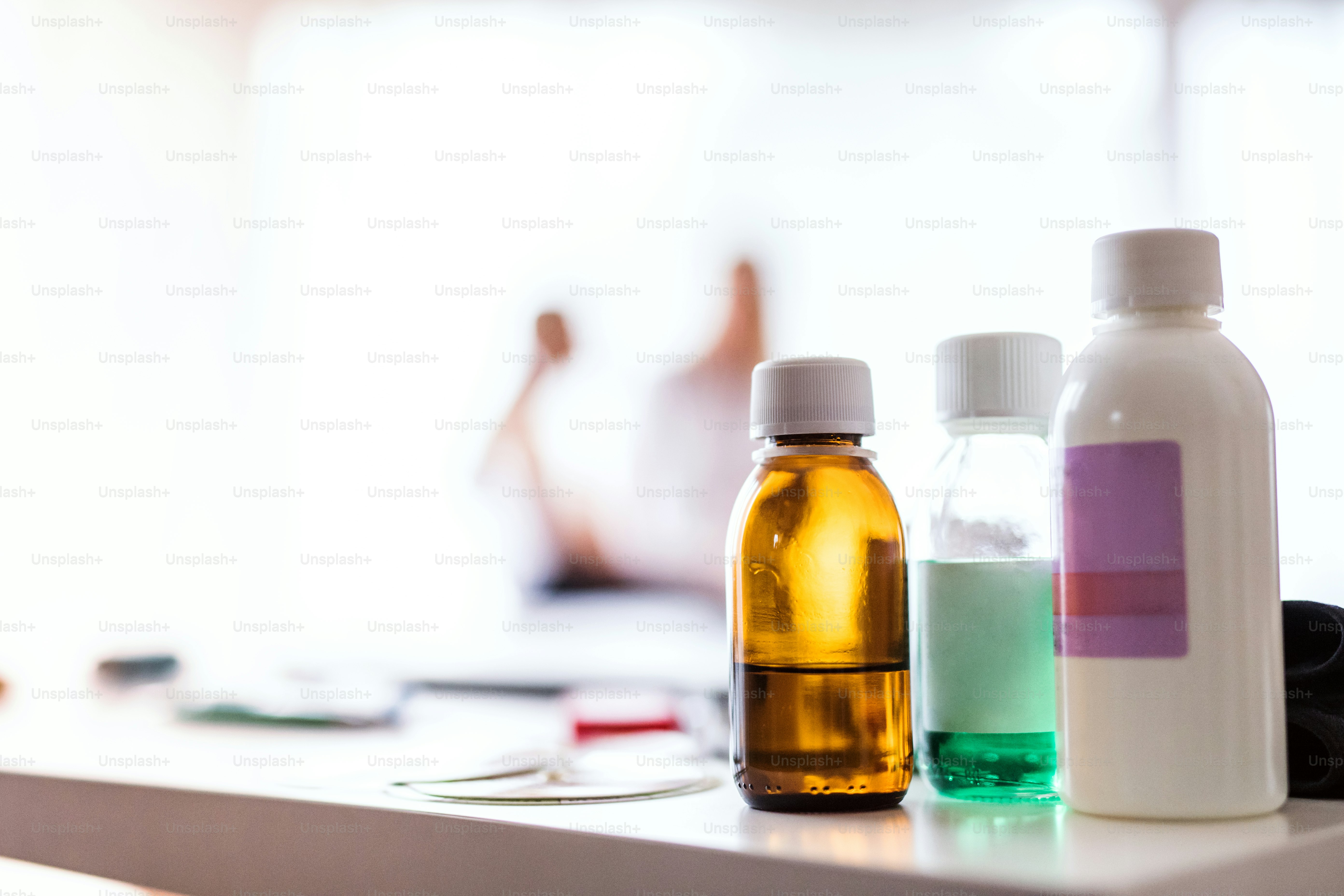 Medicine on a desk at the doctors office. photo – Syrup Image on Unsplash