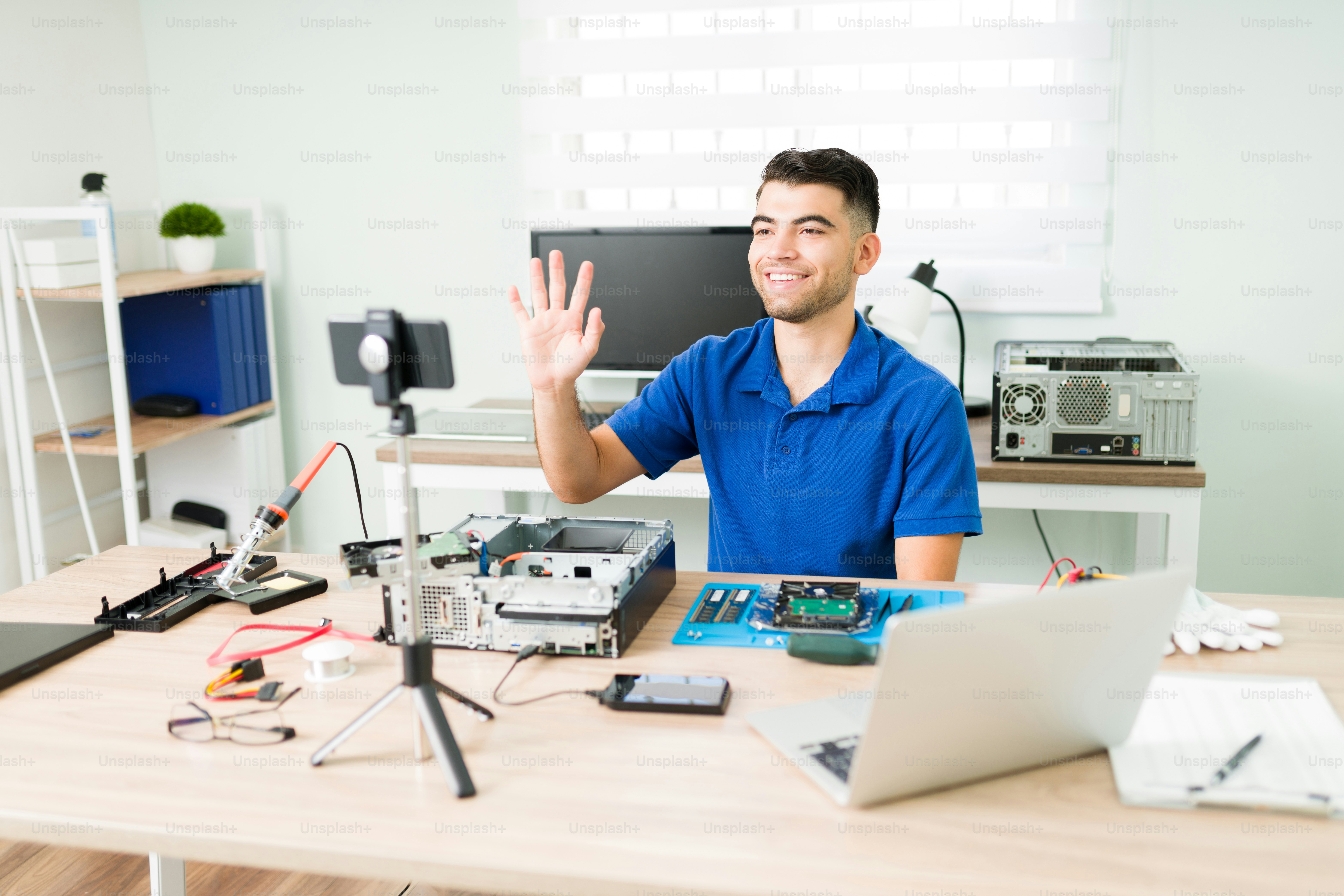 Hi, followers! Hispanic young man with a computer hobby recording a ...