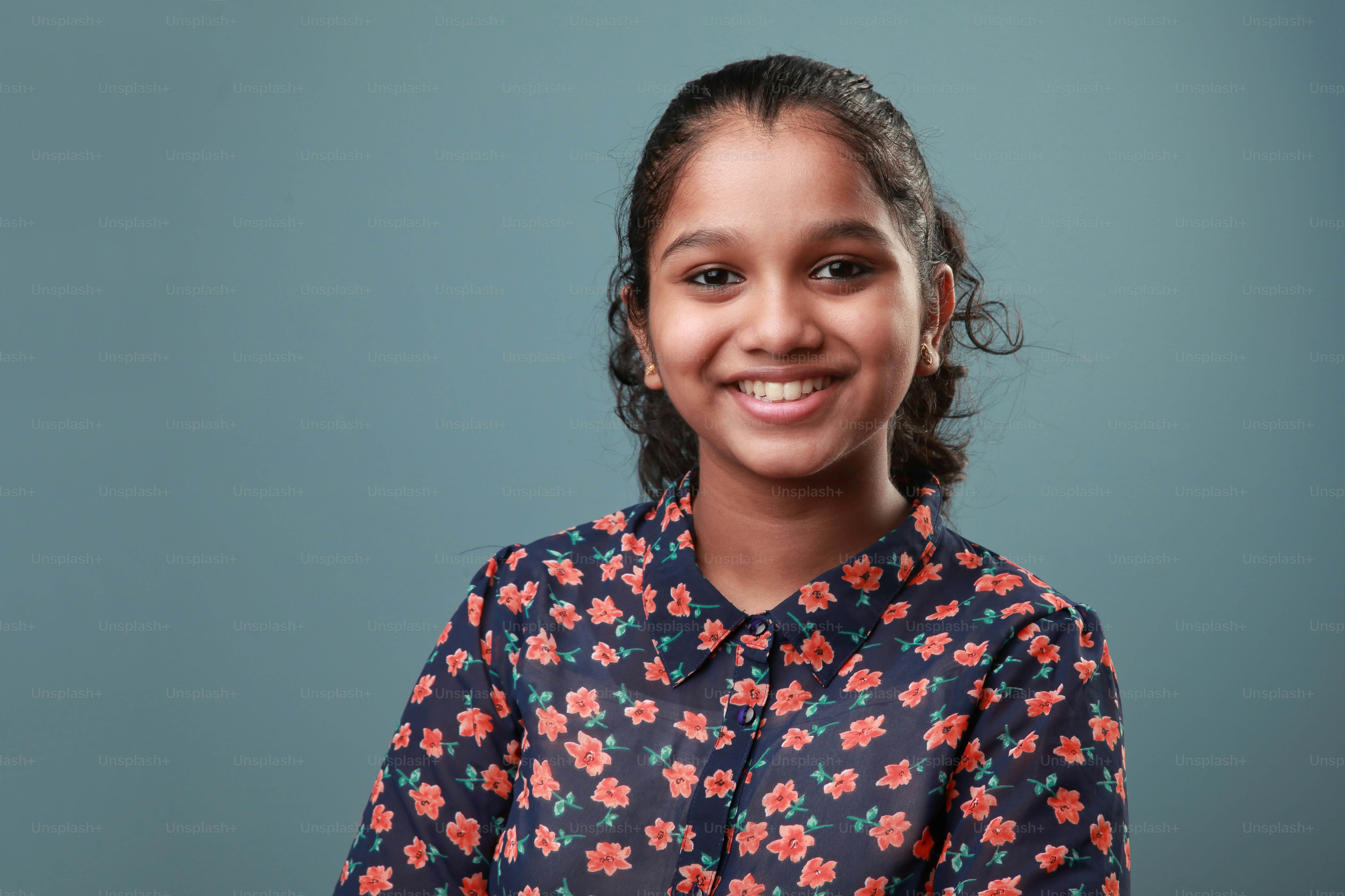 Portrait of a smiling young girl of Indian ethnicity photo – Student ...