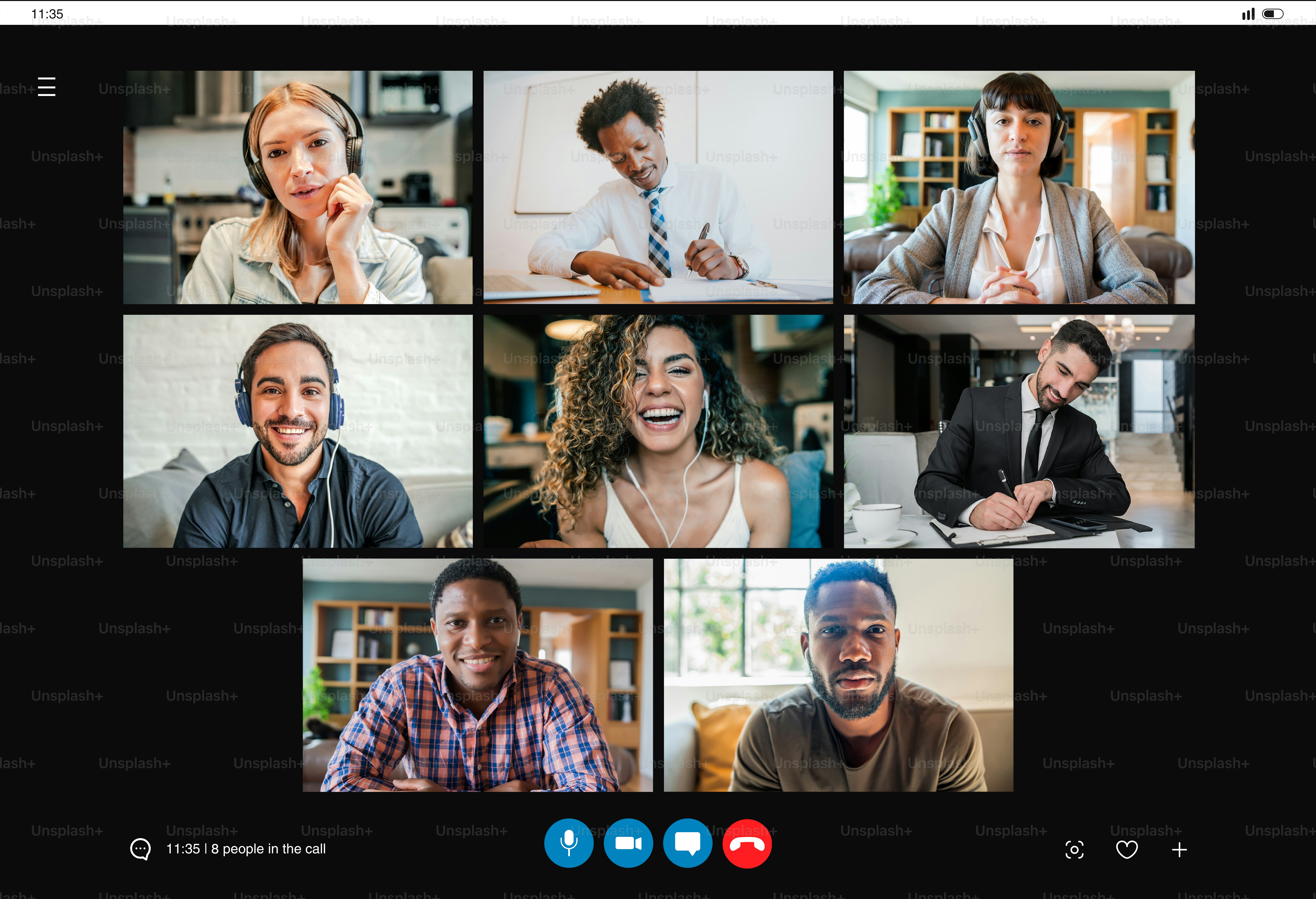 Young businessman saying hello to someone on a video call while working ...