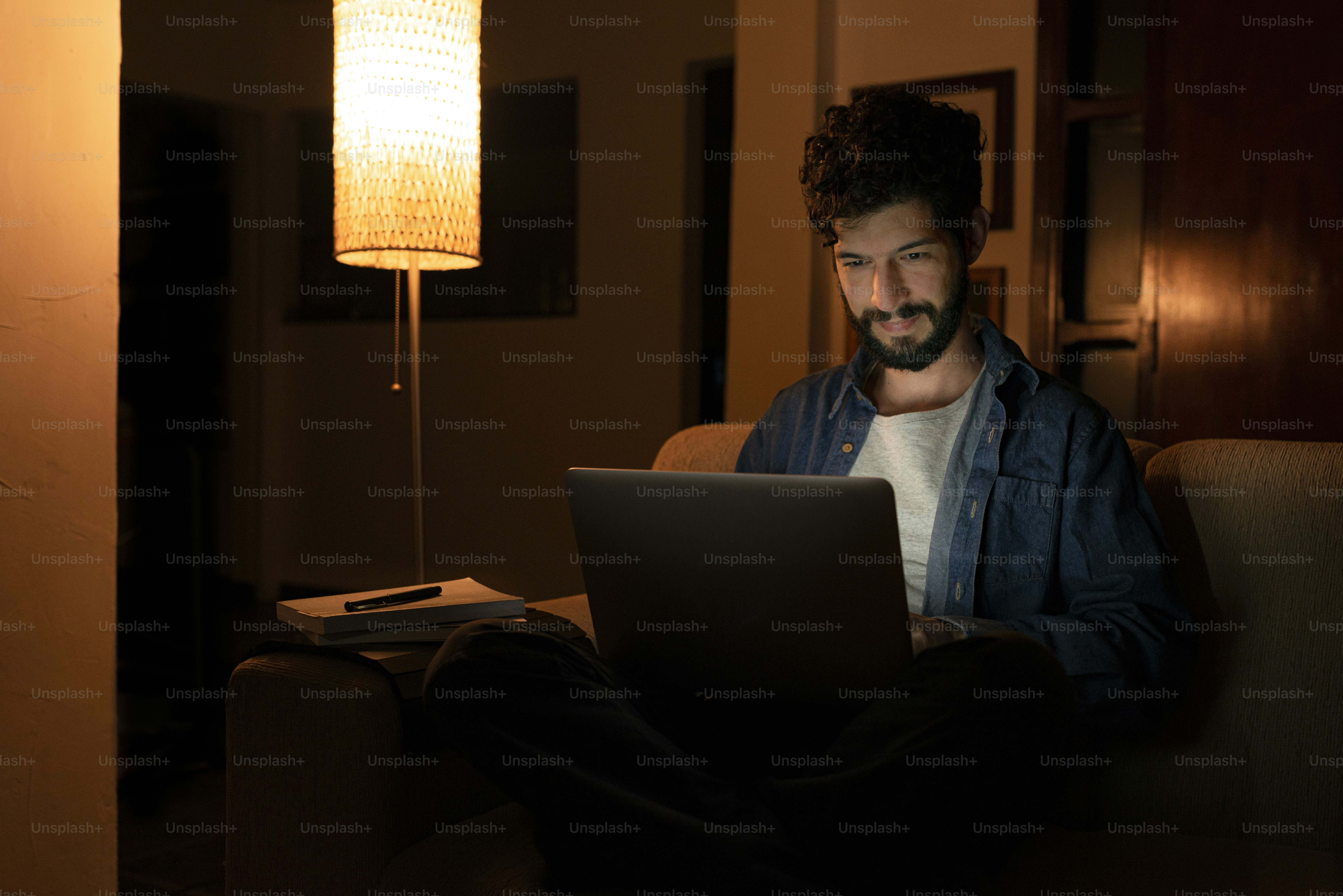 Man working on his computer late at home. Home office concept. photo ...