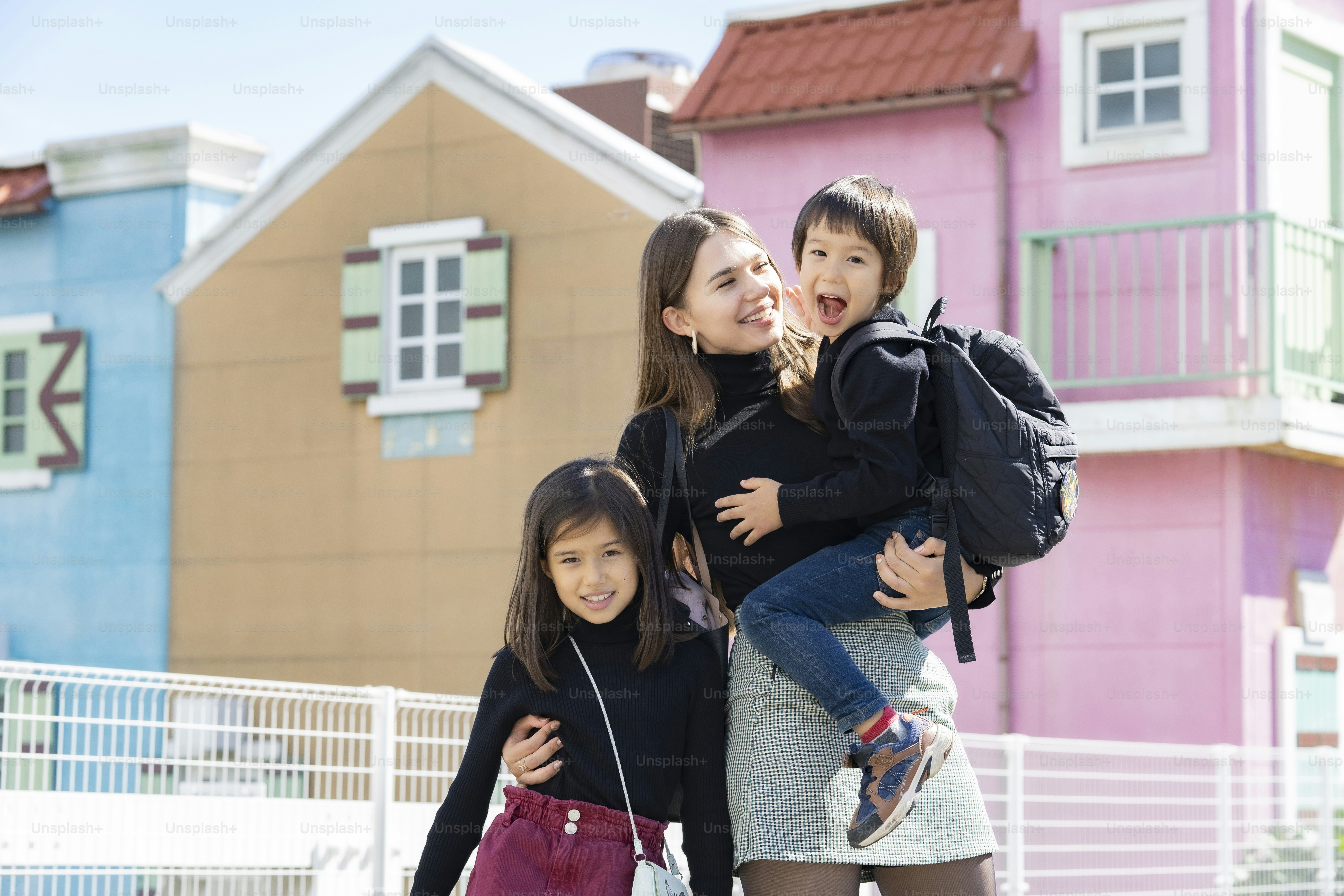 Mom and her 2 kids taking commemorative photos with a smile photo ...