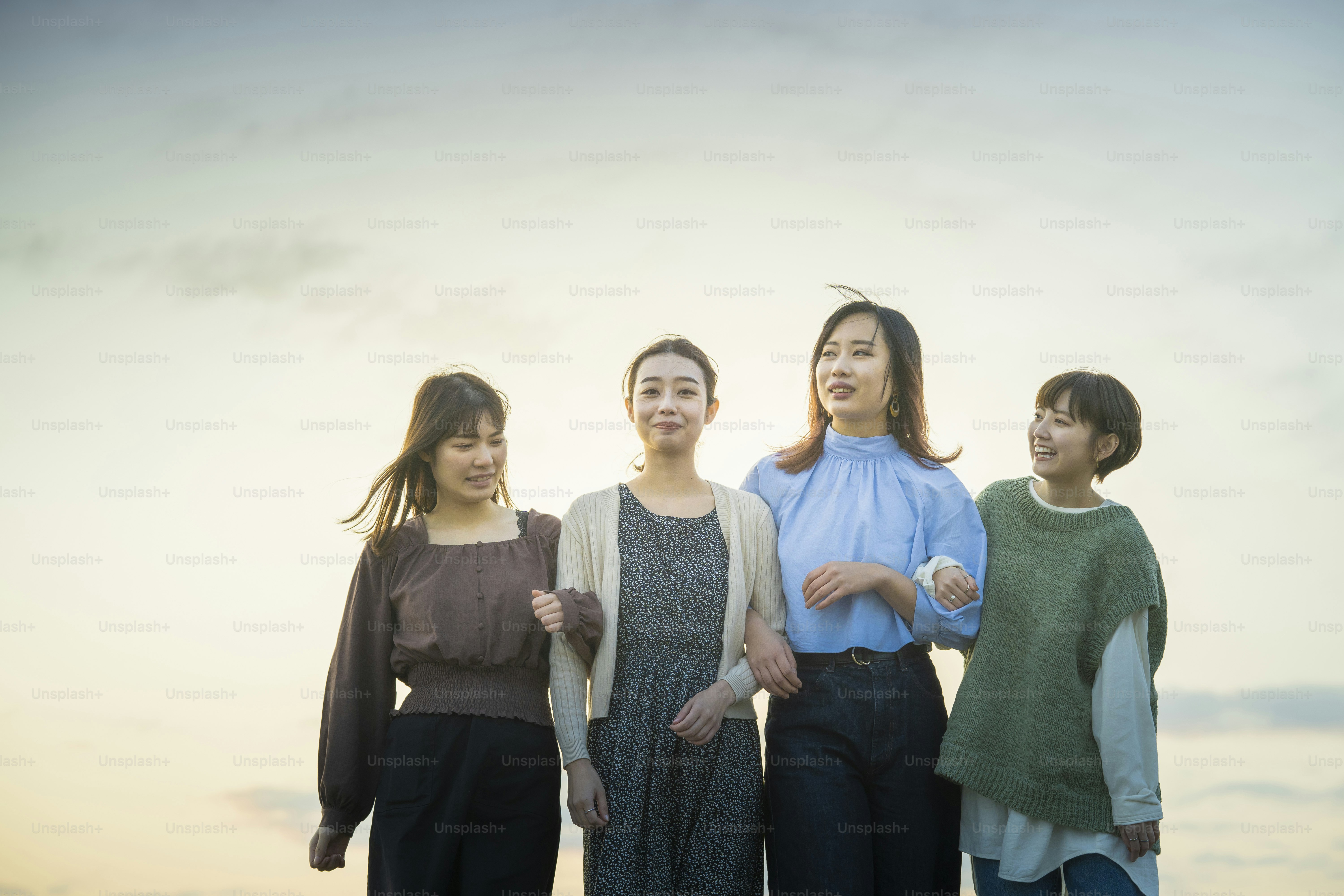 Four asian young women talking happily in the dusk photo – Portrait ...