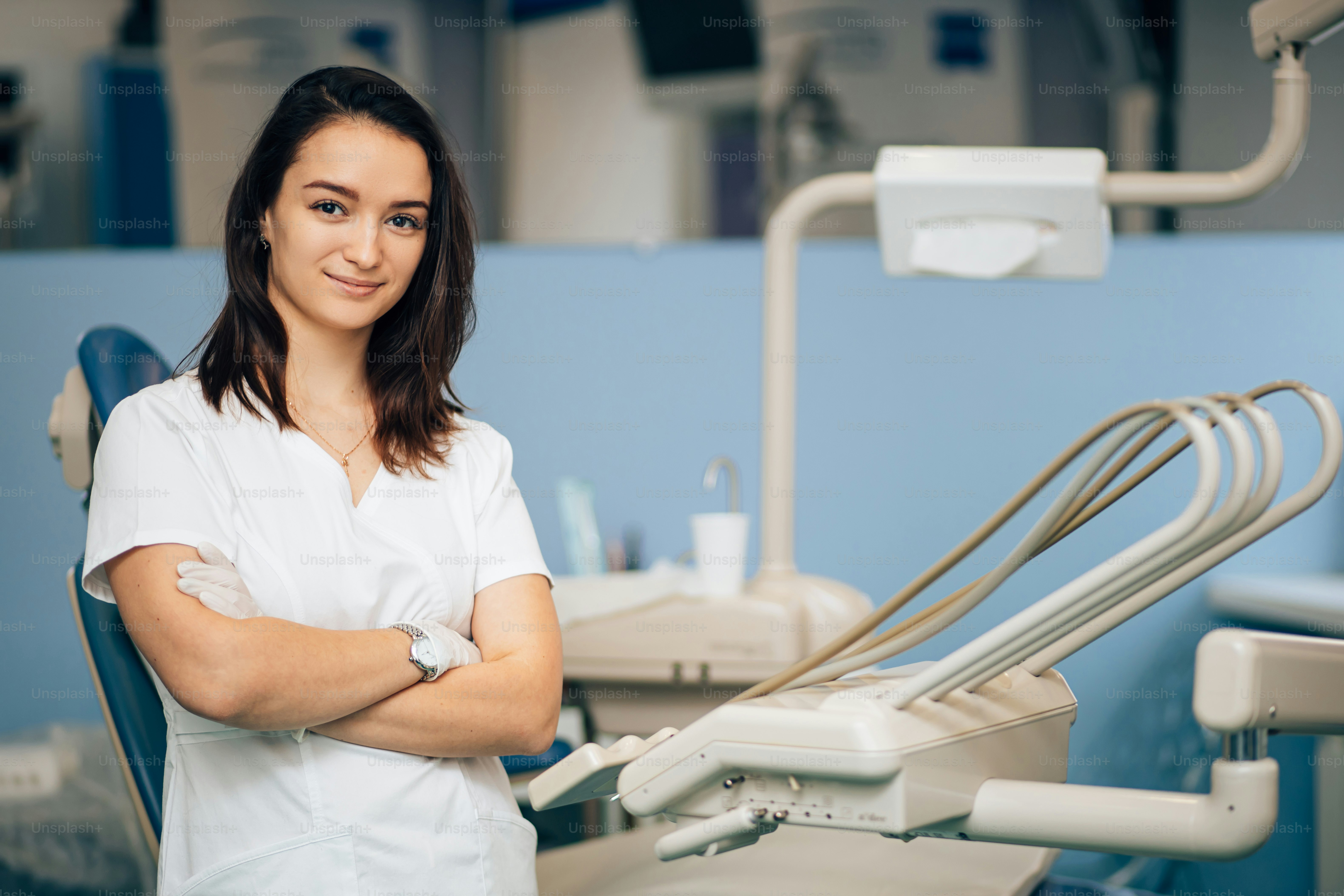 Beautiful dentist woman at work place, doctor preparing to treat ...