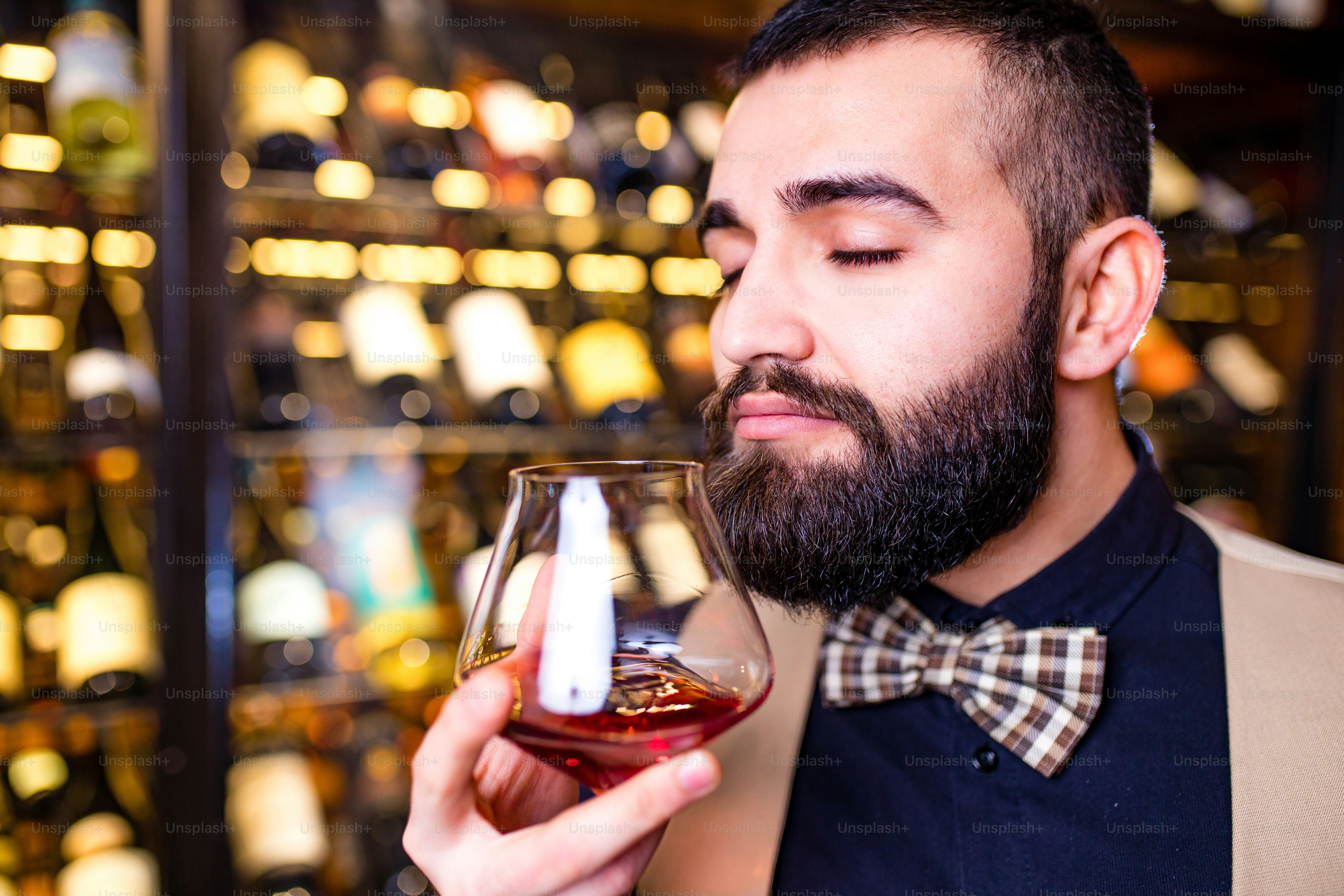 Arabian man sommelier appreciating drink in lux hotel. photo – Wine ...