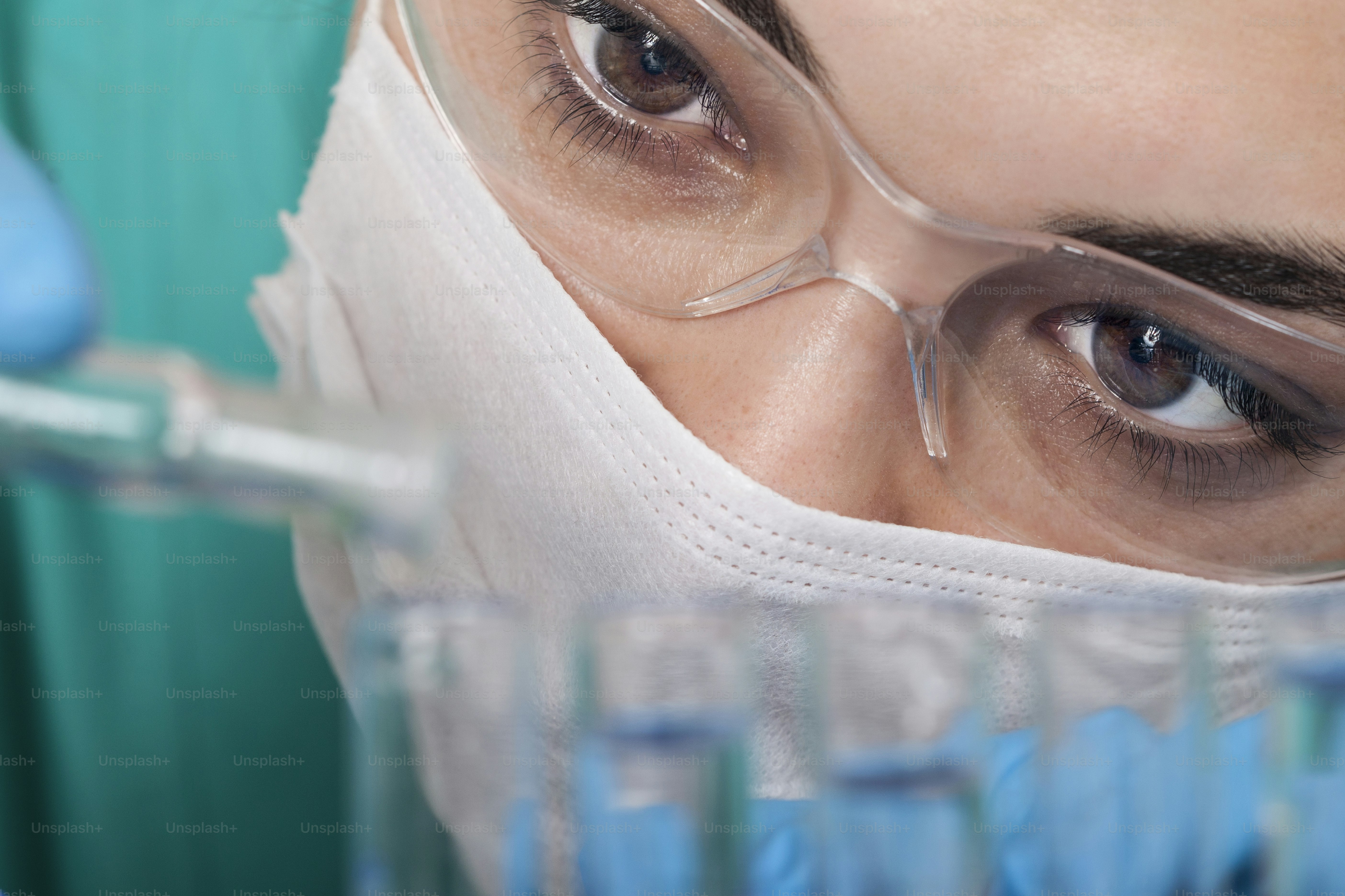 Doctor with a mask on his face photo – Medical exam Image on Unsplash