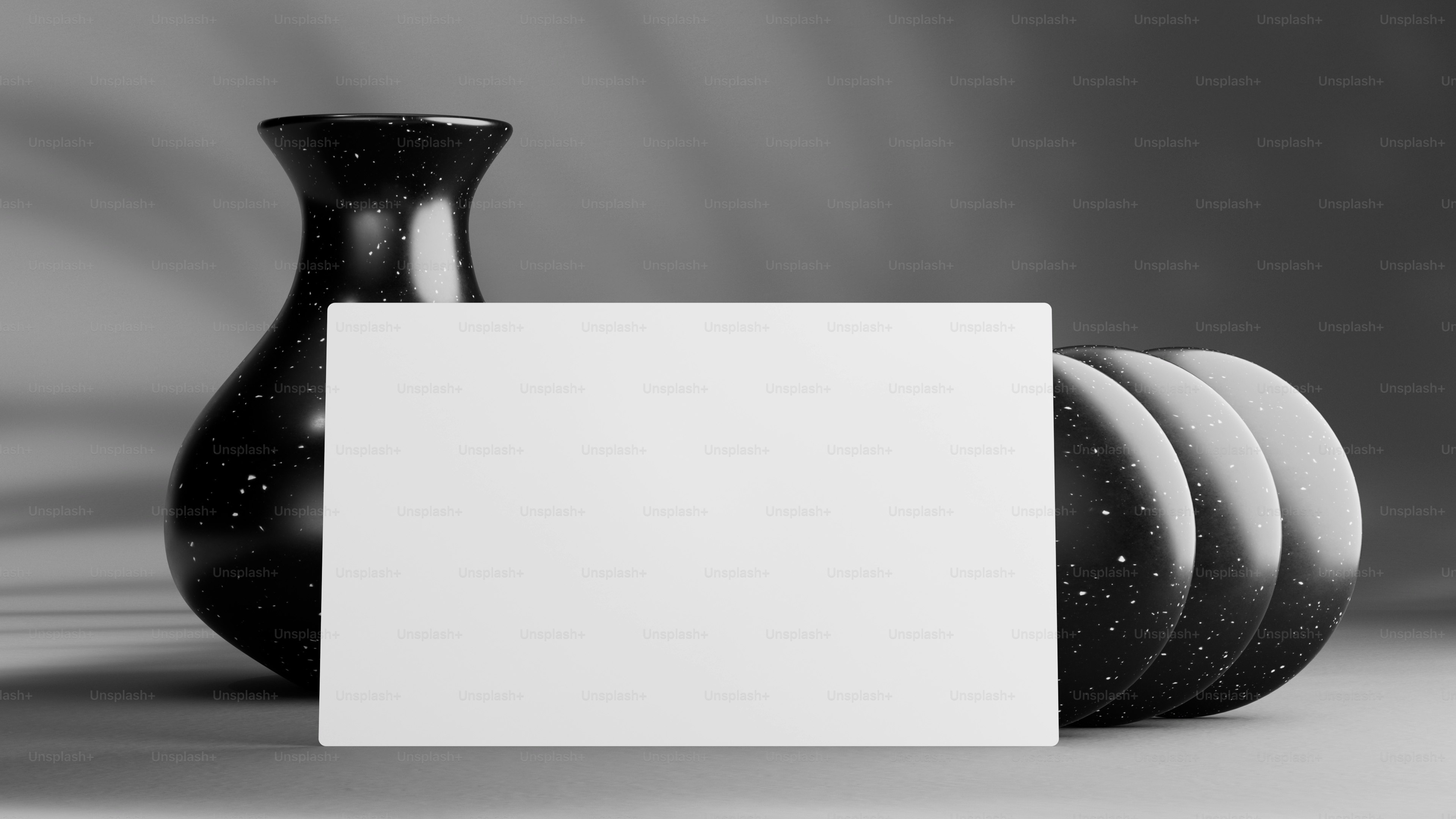 A black vase with a blank card next to it photo – Flyer mockup Image on ...