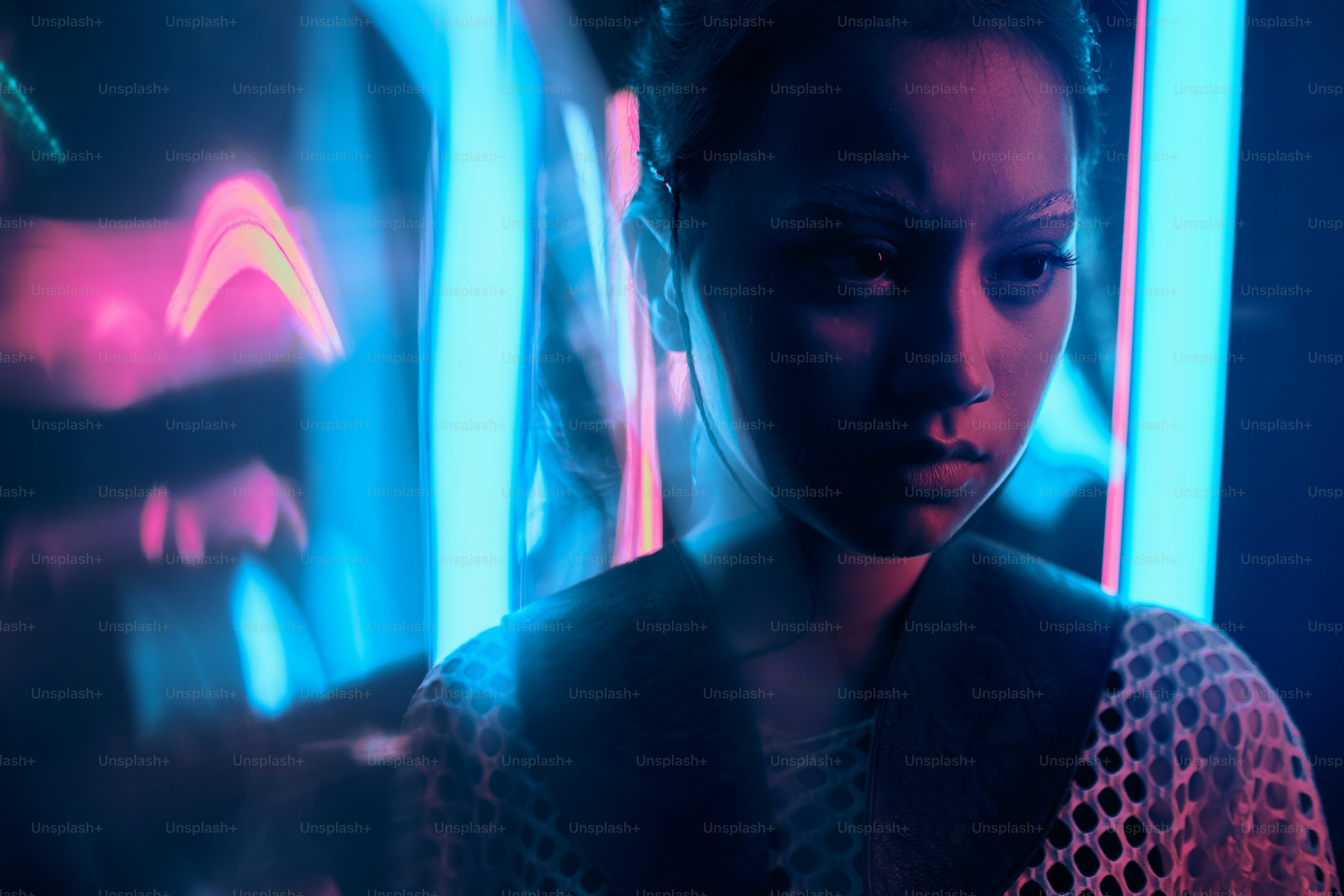 Futuristic portrait of asian teenager in neon light with sword like ...