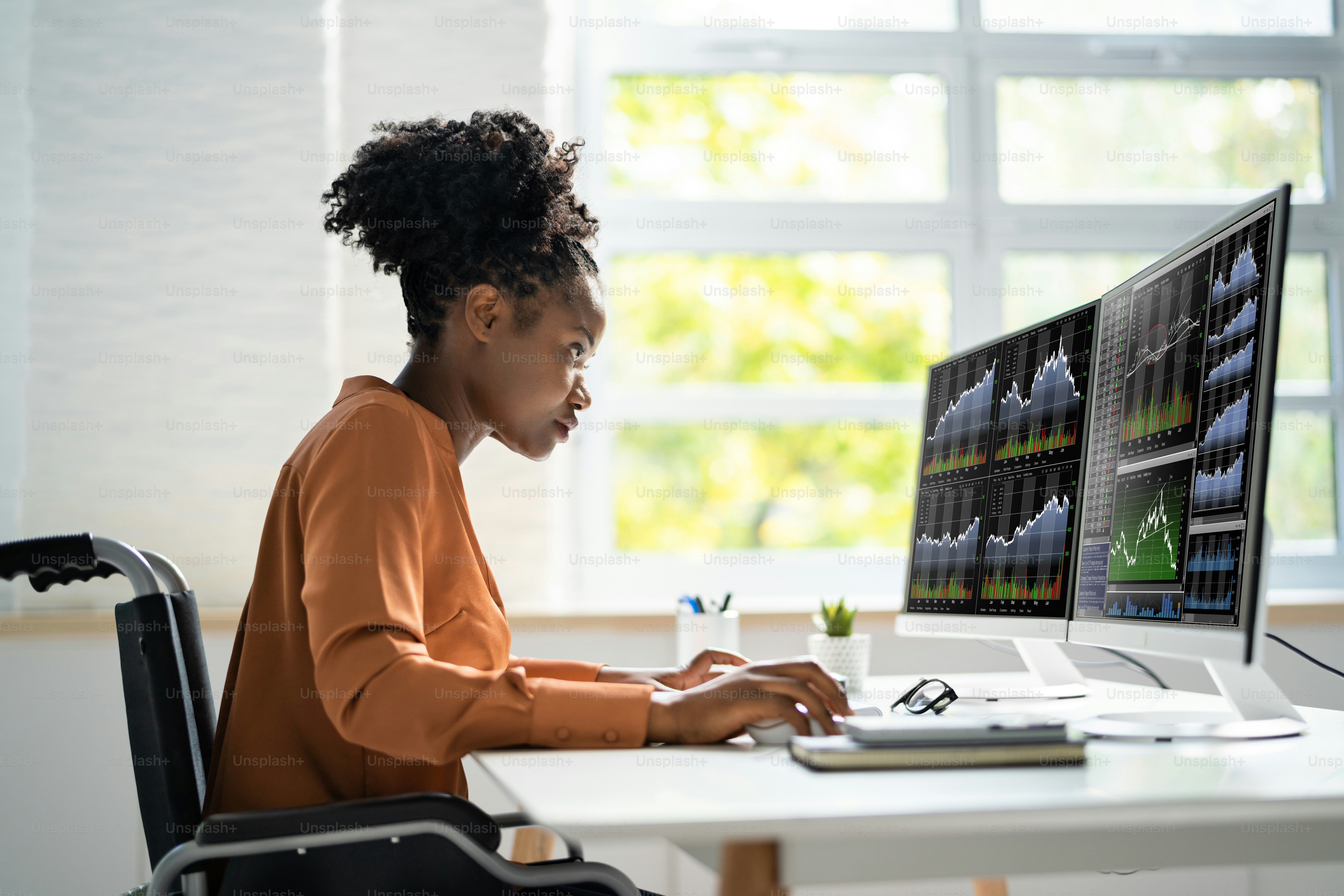 Stock Market Analyst At Office Desk Using Multiple Screens photo ...