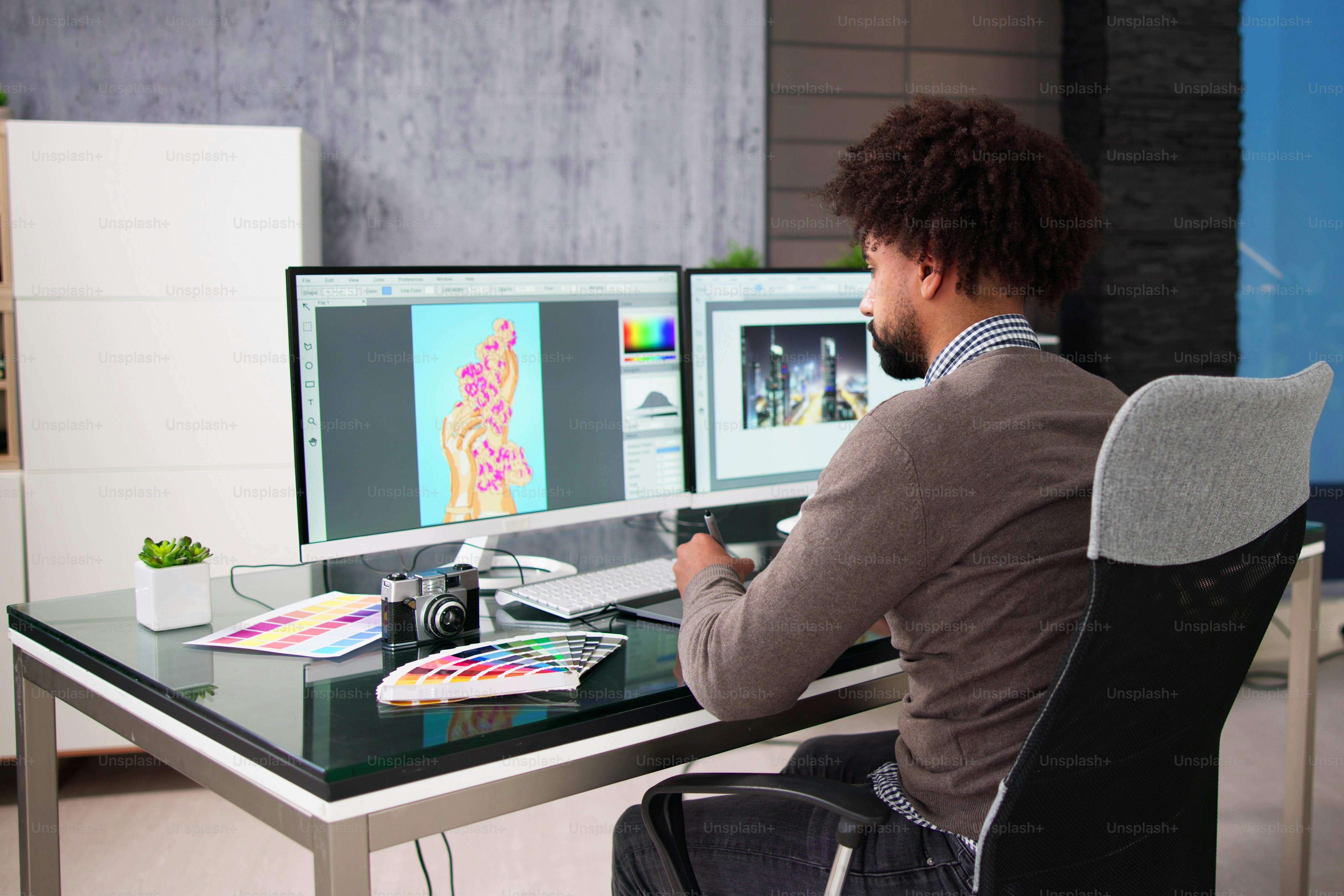 African Graphic Web Designer Using Design Editing Software photo – Desk ...