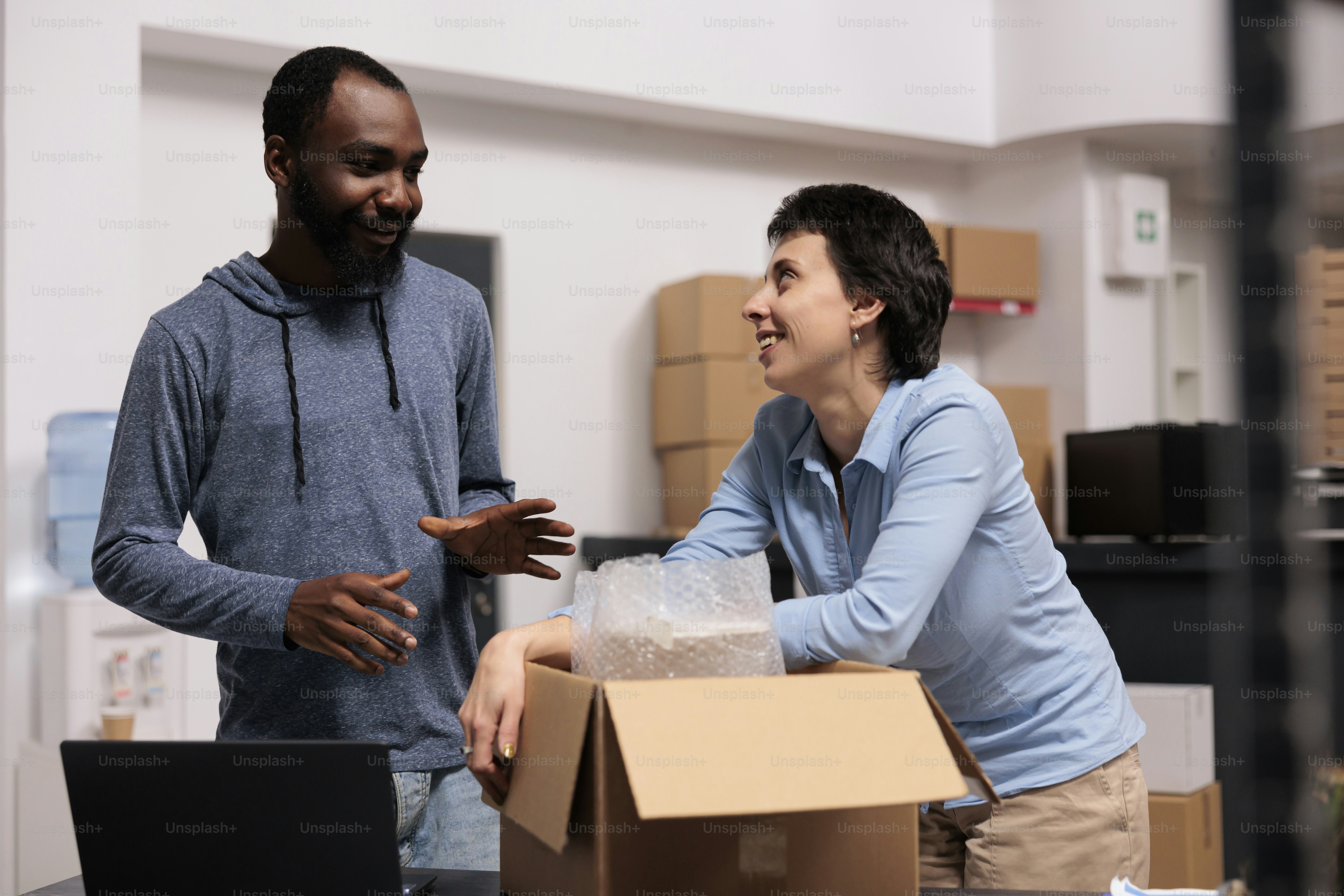 Storehouse team discussing shipping logistics after putting client ...