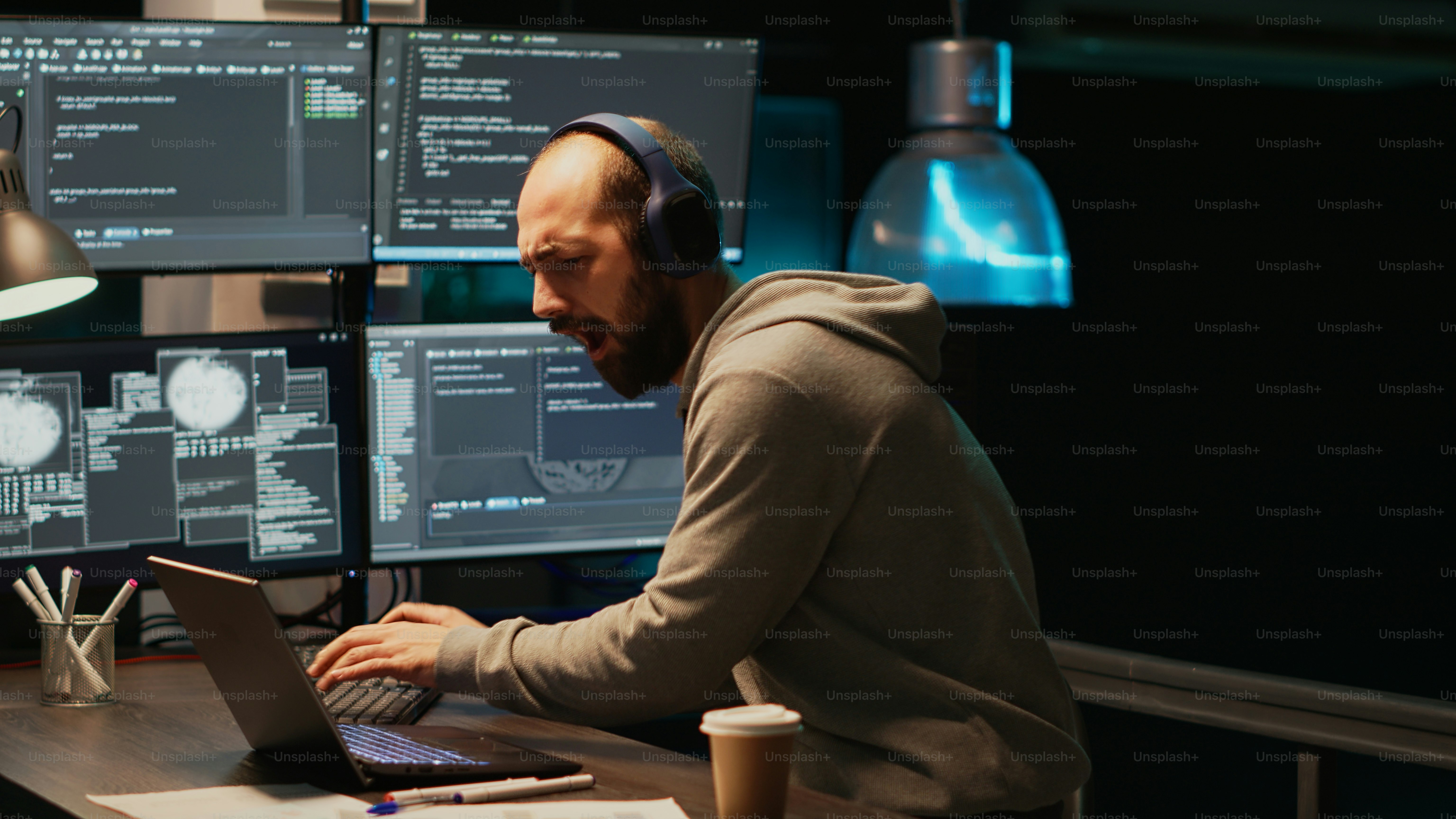 A male programer working with laptop and coding on computer. photo ...