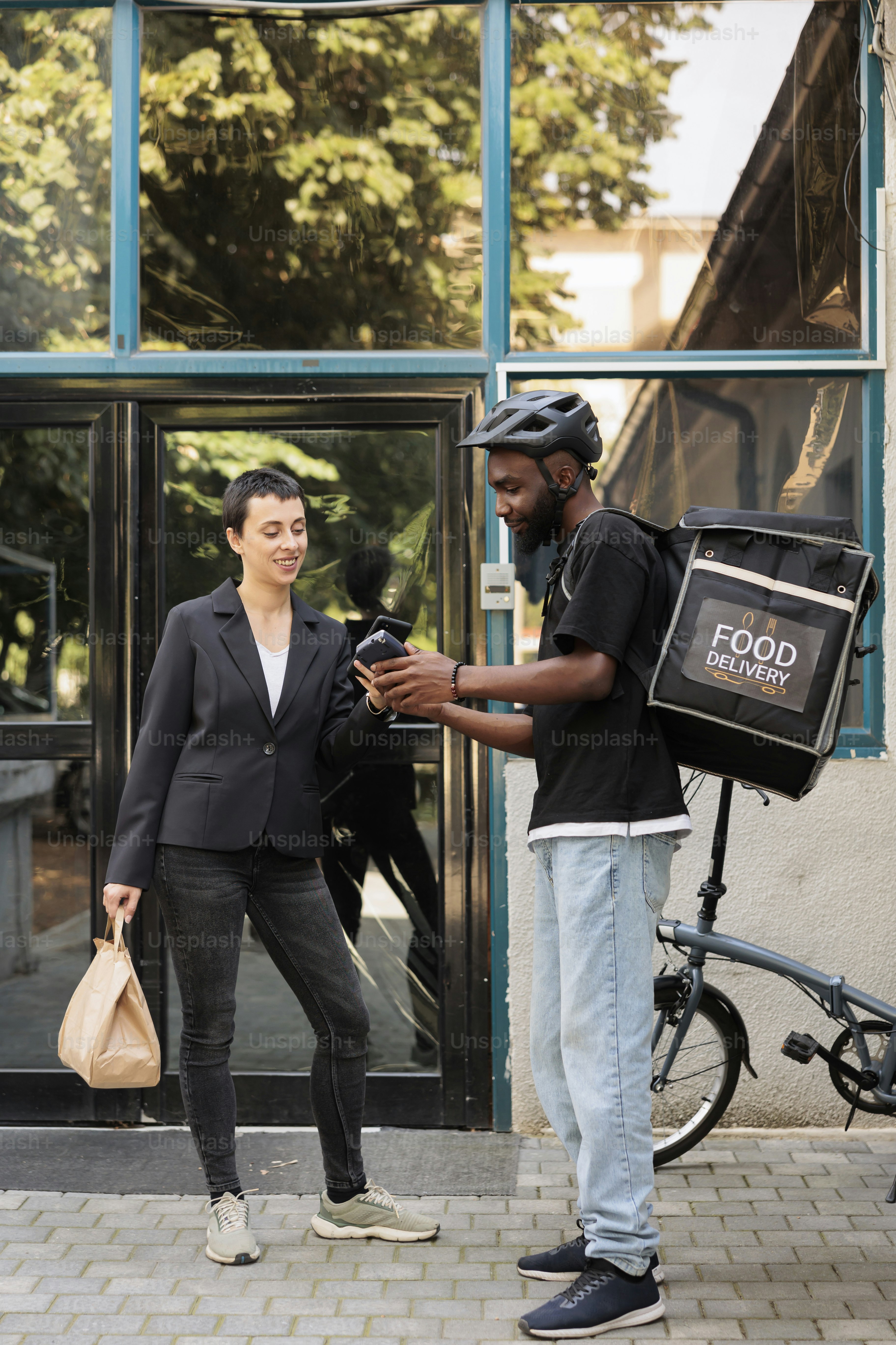Workplace food delivery, smartphone pos terminal payment, smiling woman ...
