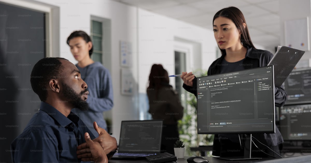 Team of system engineer working on terminal window with html script and ... Team of system engineer working on terminal window with html script and ...