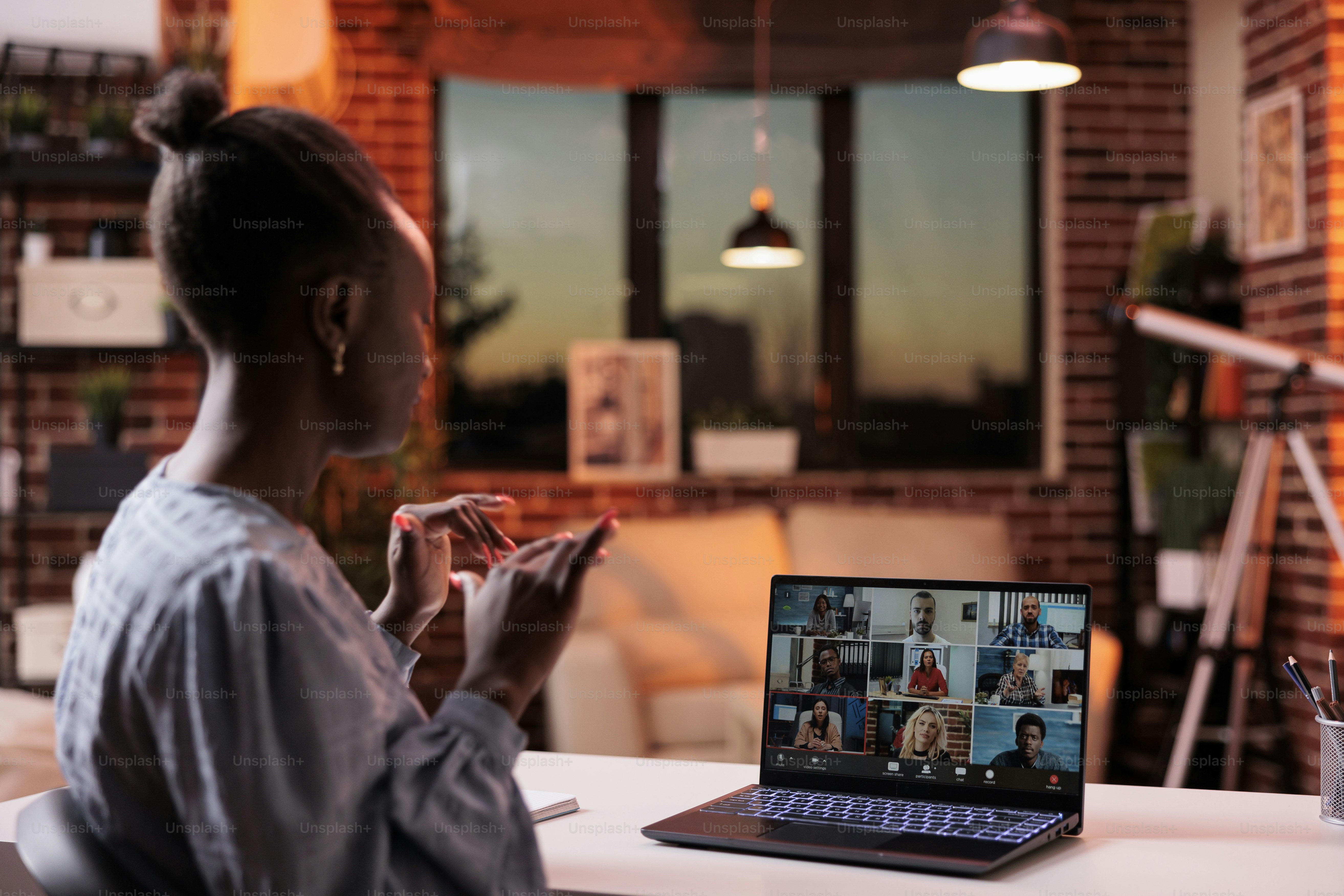 Corporate worker chatting with remote team on videocall using laptop ...