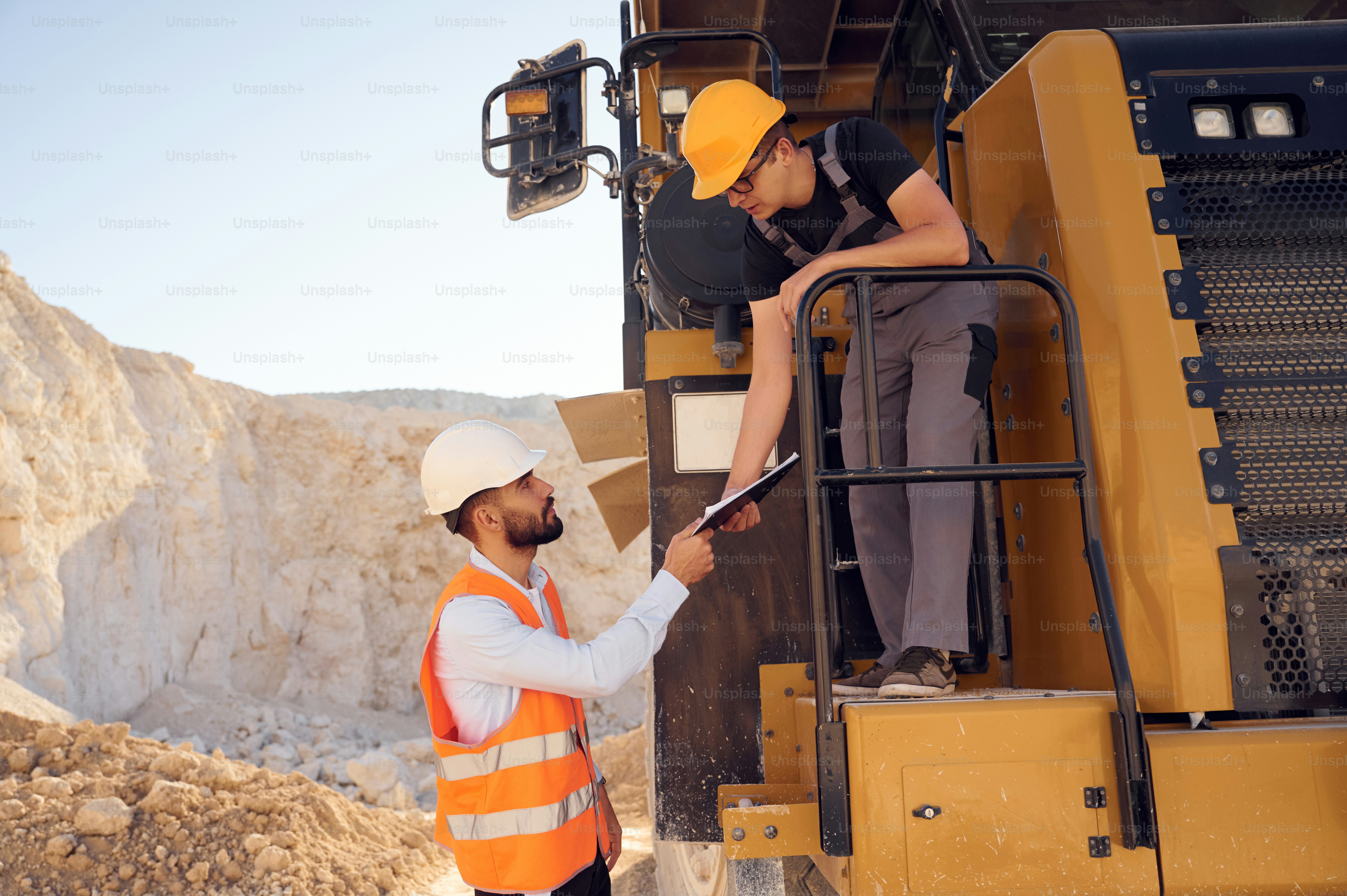 Taking the documents. Two men in uniform are working together in the ...