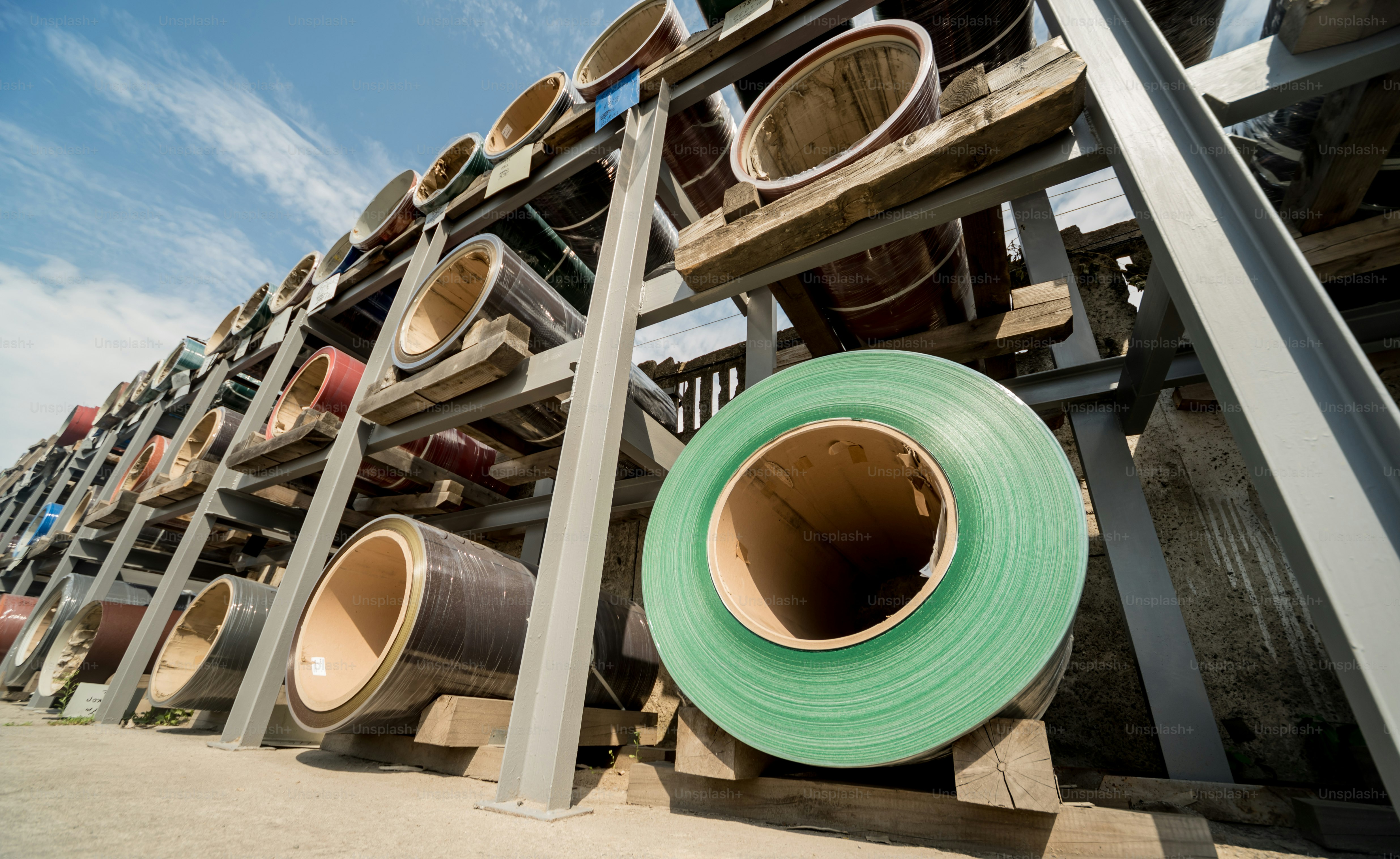 Rolled steel coils in storage areas of metalwork manufacturing photo ...